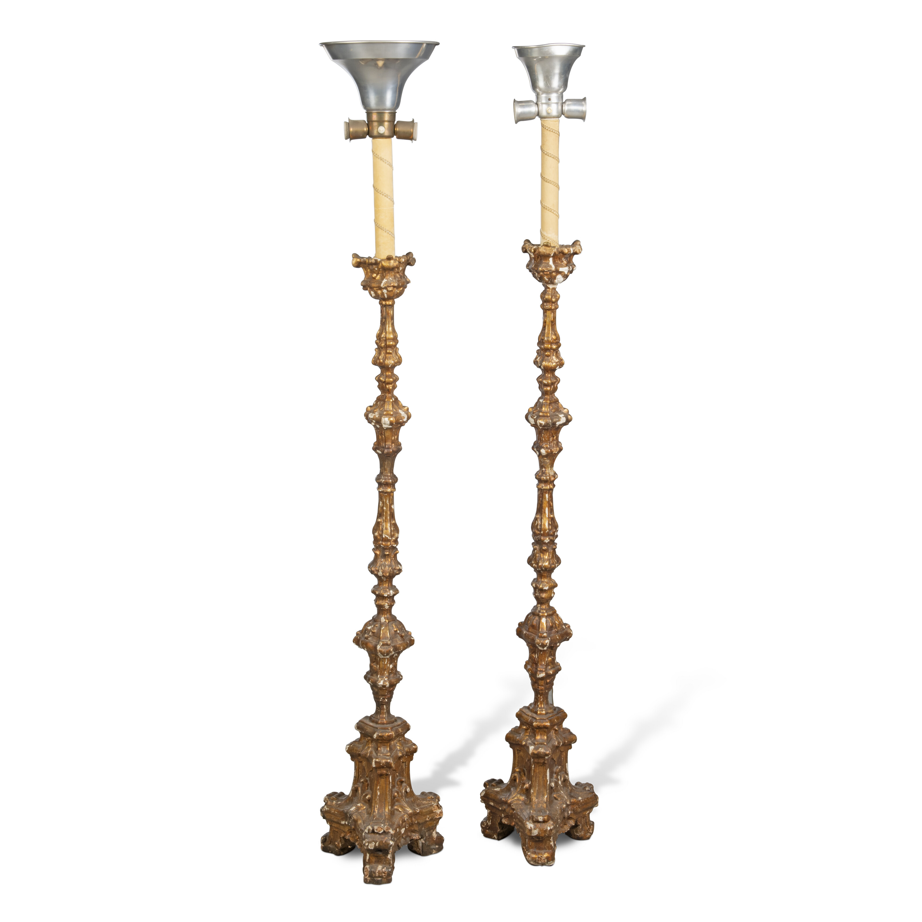 A PAIR OF ITALIAN CARVED AND GILTWOOD ALTAR CANDLESTICKS, FIRST HALF ...