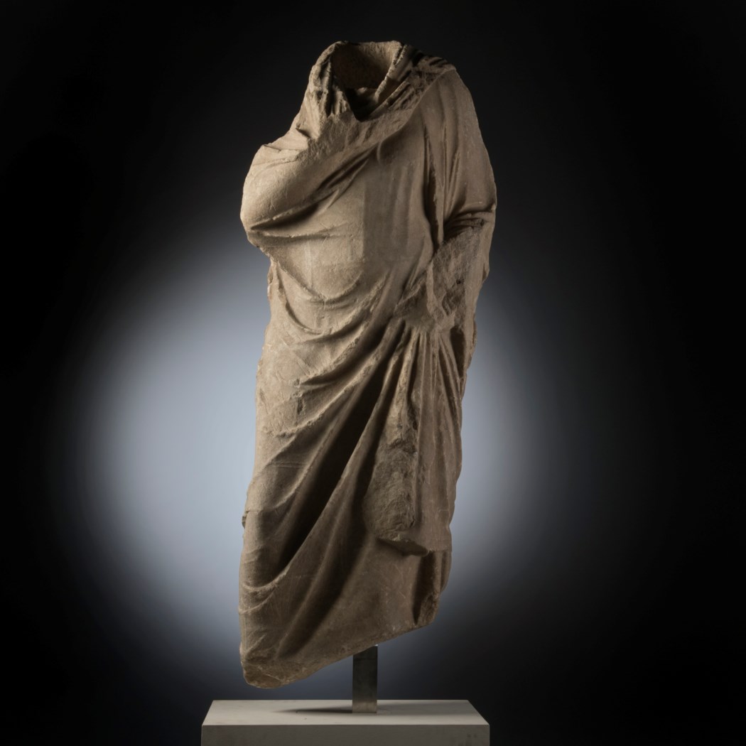 A GREEK MARBLE DRAPED MALE TORSO, LATE HELLENISTIC PERIOD, CIRCA 1ST ...