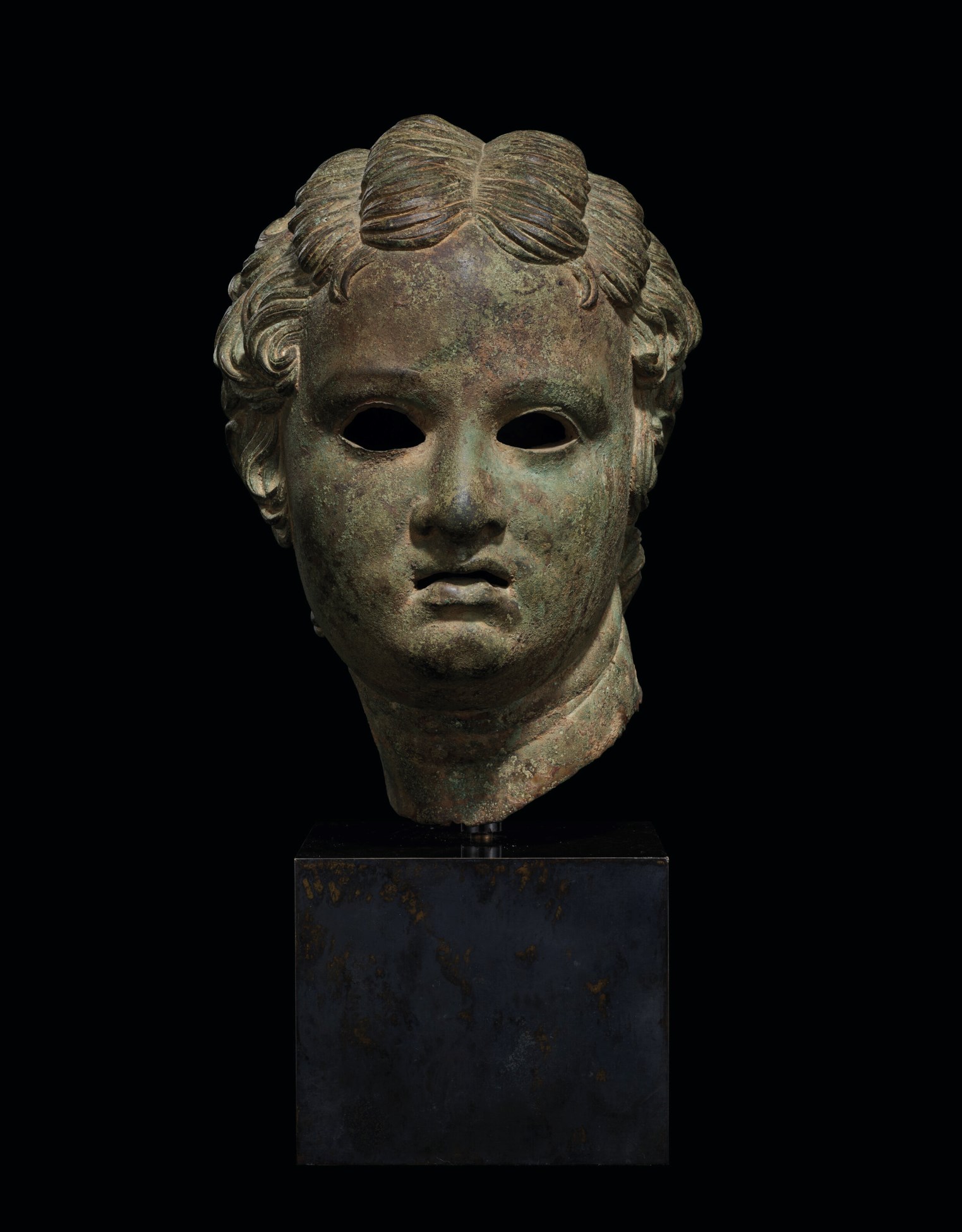 A GREEK BRONZE HEAD OF EROS, HELLENISTIC PERIOD, CIRCA 2ND-1ST CENTURY ...
