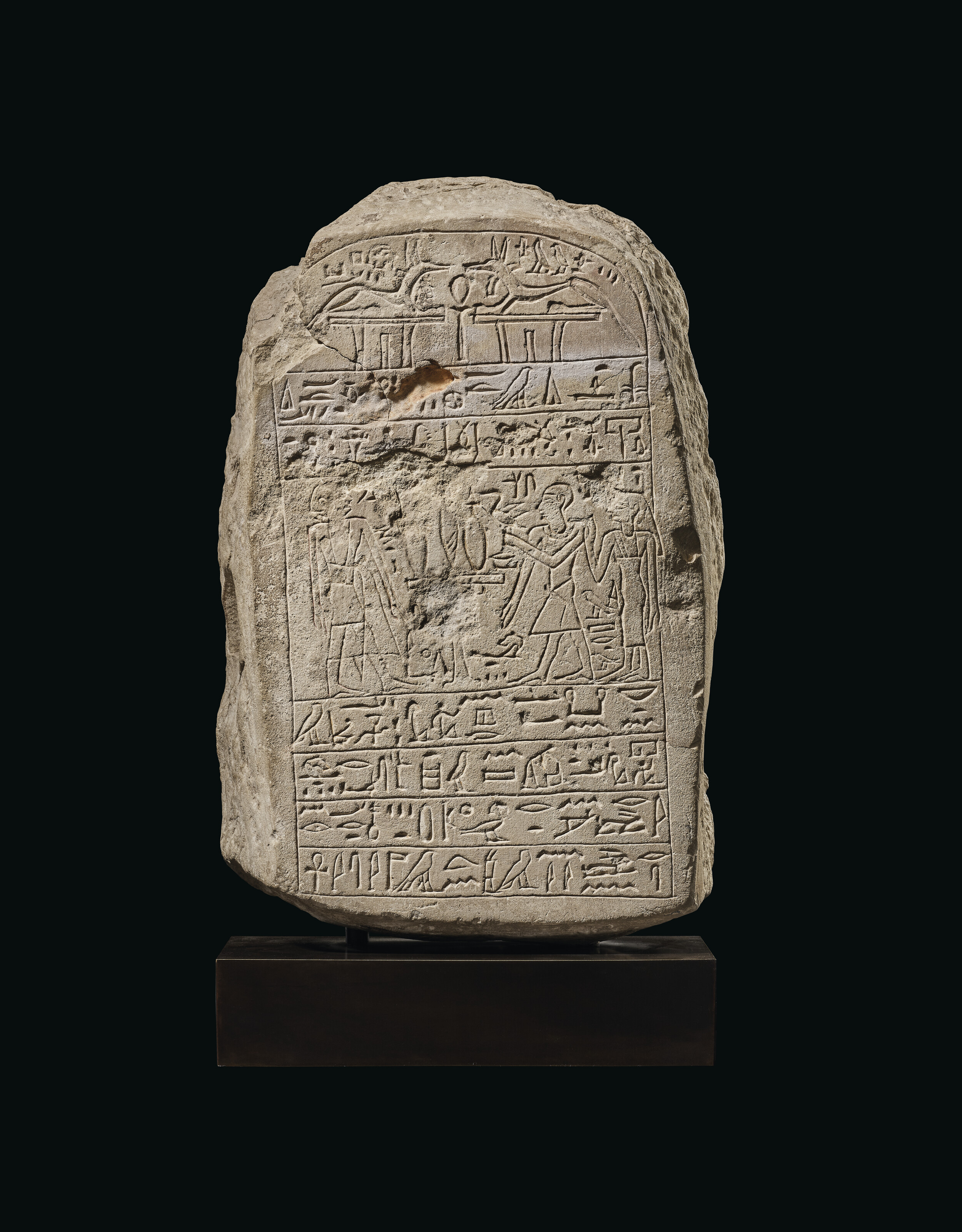 AN EGYPTIAN LIMESTONE ROUND-TOPPED STELE, SECOND INTERMEDIATE PERIOD ...