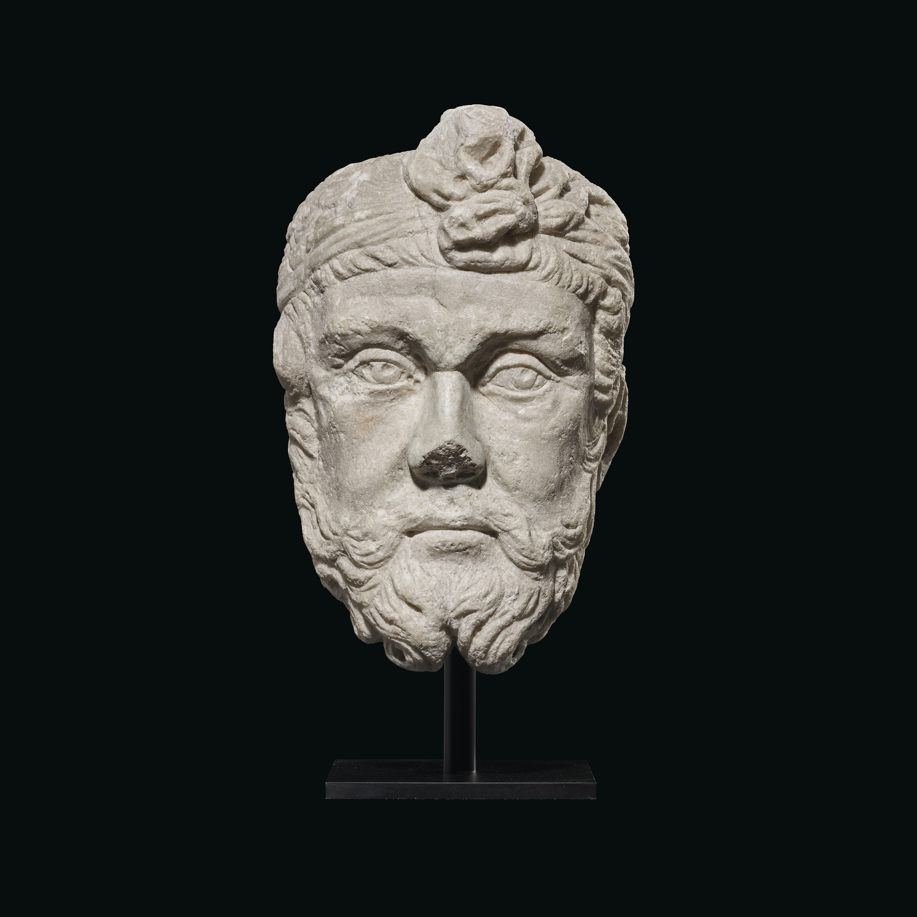 A ROMAN MARBLE HEAD OF A BEARDED BARBARIAN, CIRCA 3RD CENTURY A.D ...