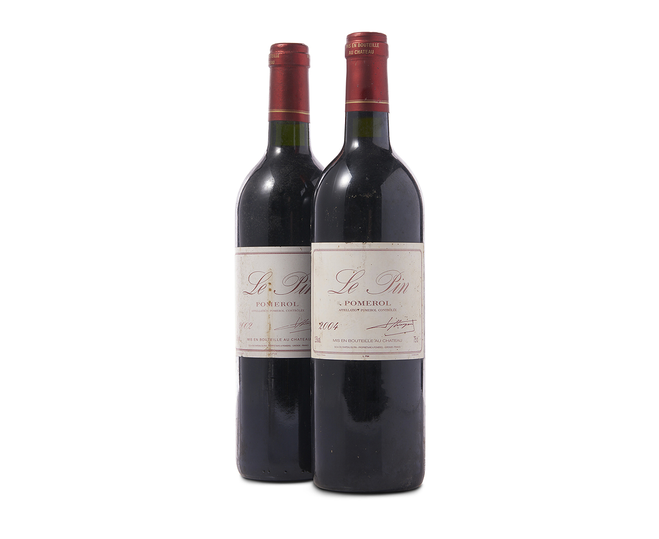 Mixed Le Pin 2002-2004, Le Pin, Pomerol 2002Bin-soiled labels. One ...