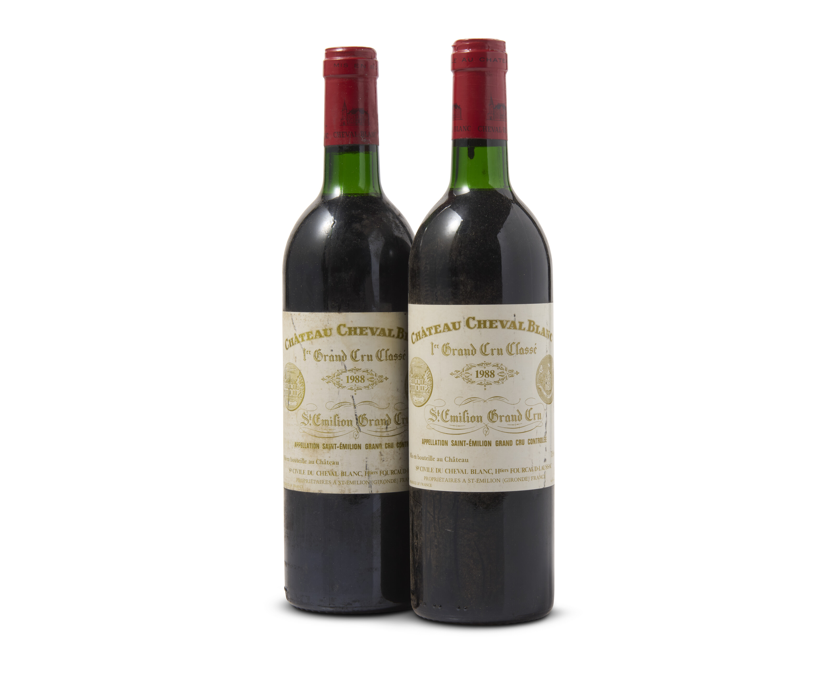 Château Cheval Blanc 1988, Scuffed capsules. Badly bin-soiled and ...