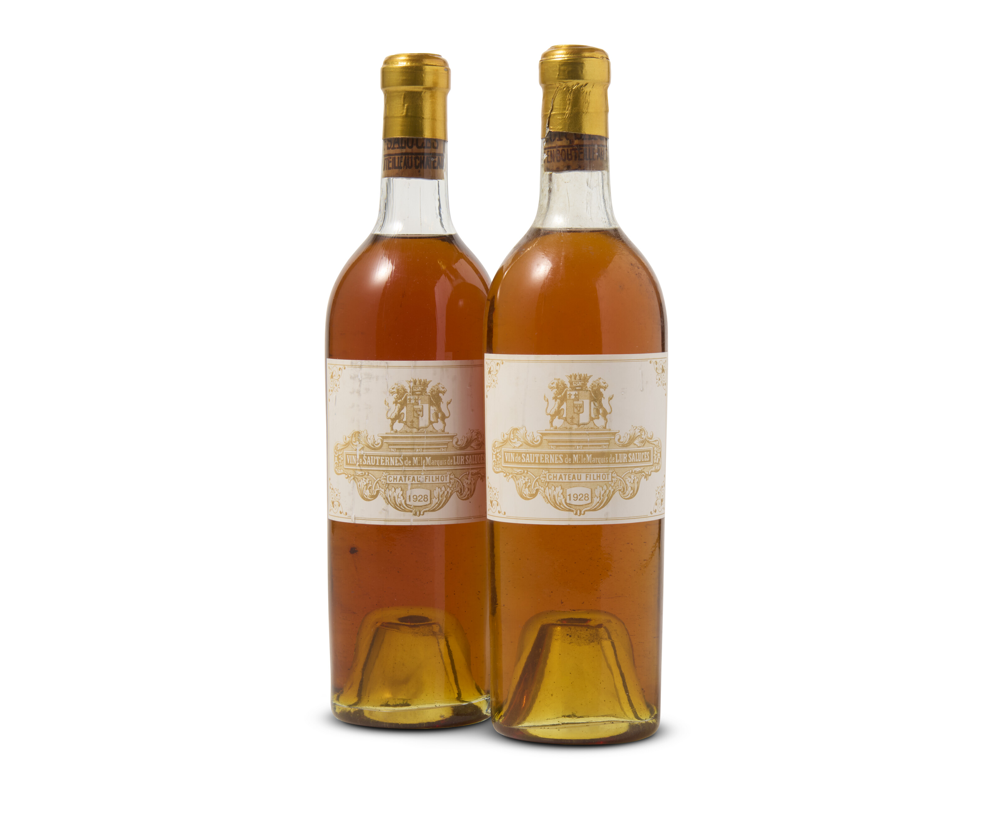 Château Filhot 1928, Slightly creased capsules. Bin-soiled labels ...