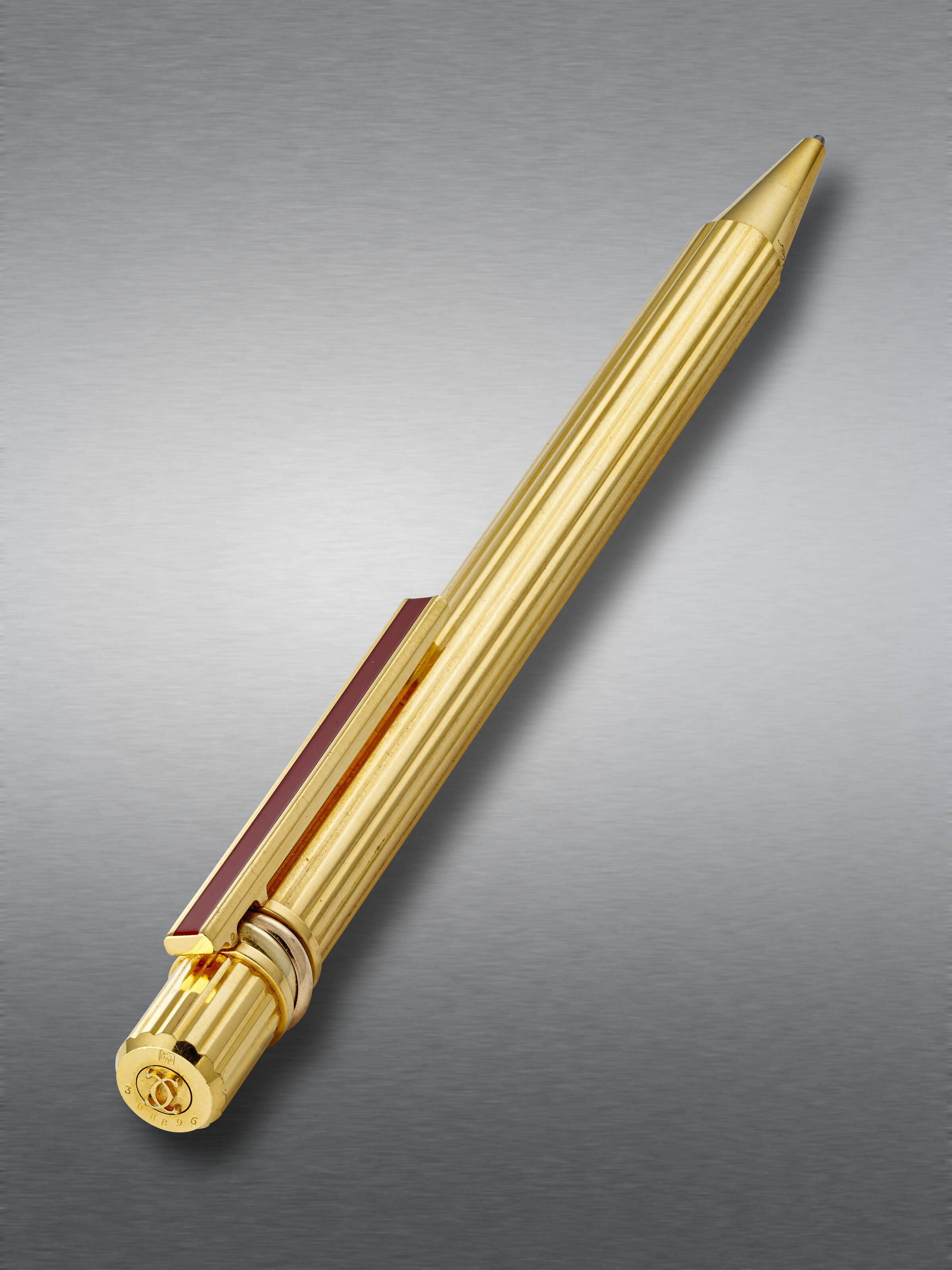 CARTIER, GOLD PLATED BALLPOINT PEN 'MUST DE CARTIER', | Christie’s