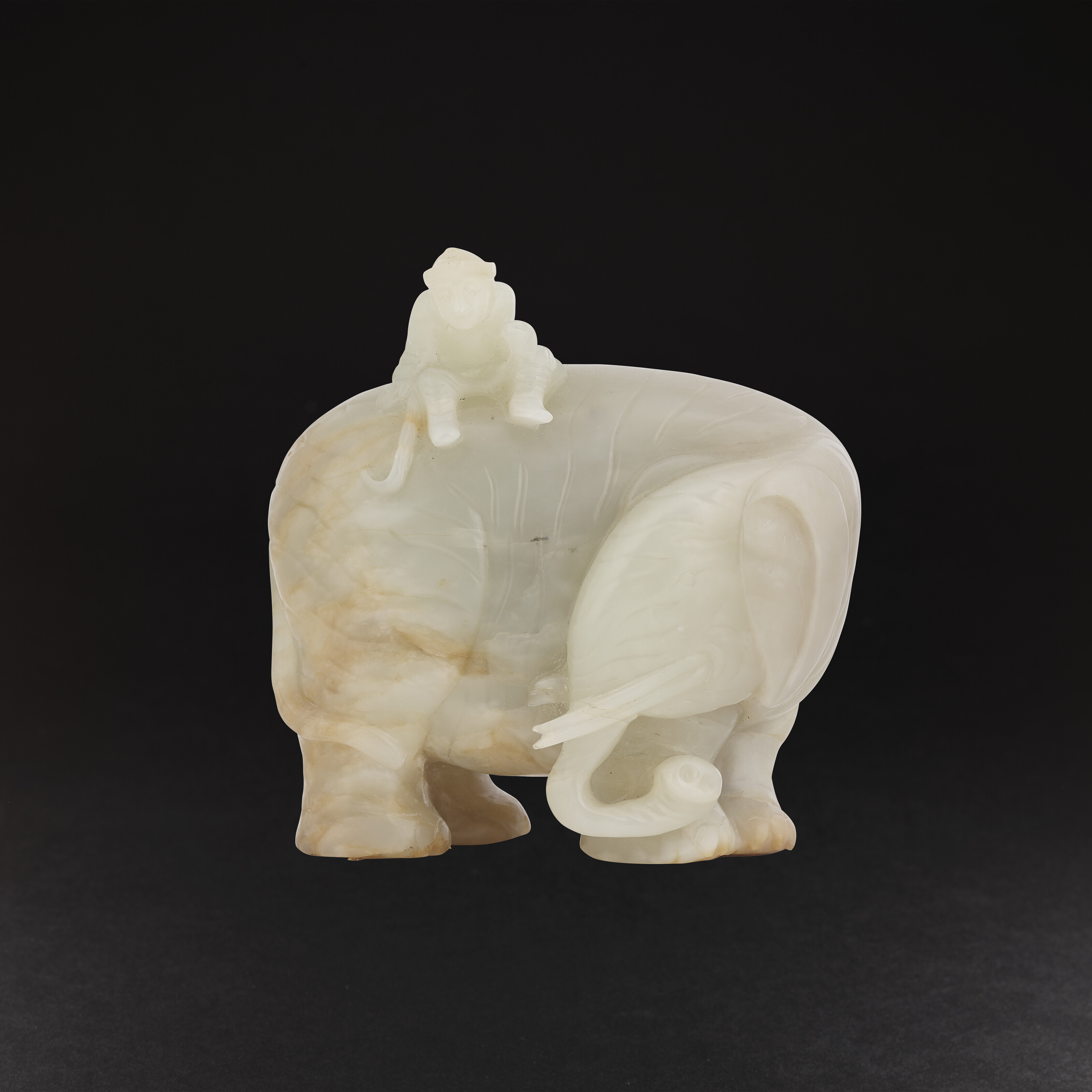 A WHITE JADE 'ELEPHANT AND BOY' GROUP, | Christie’s