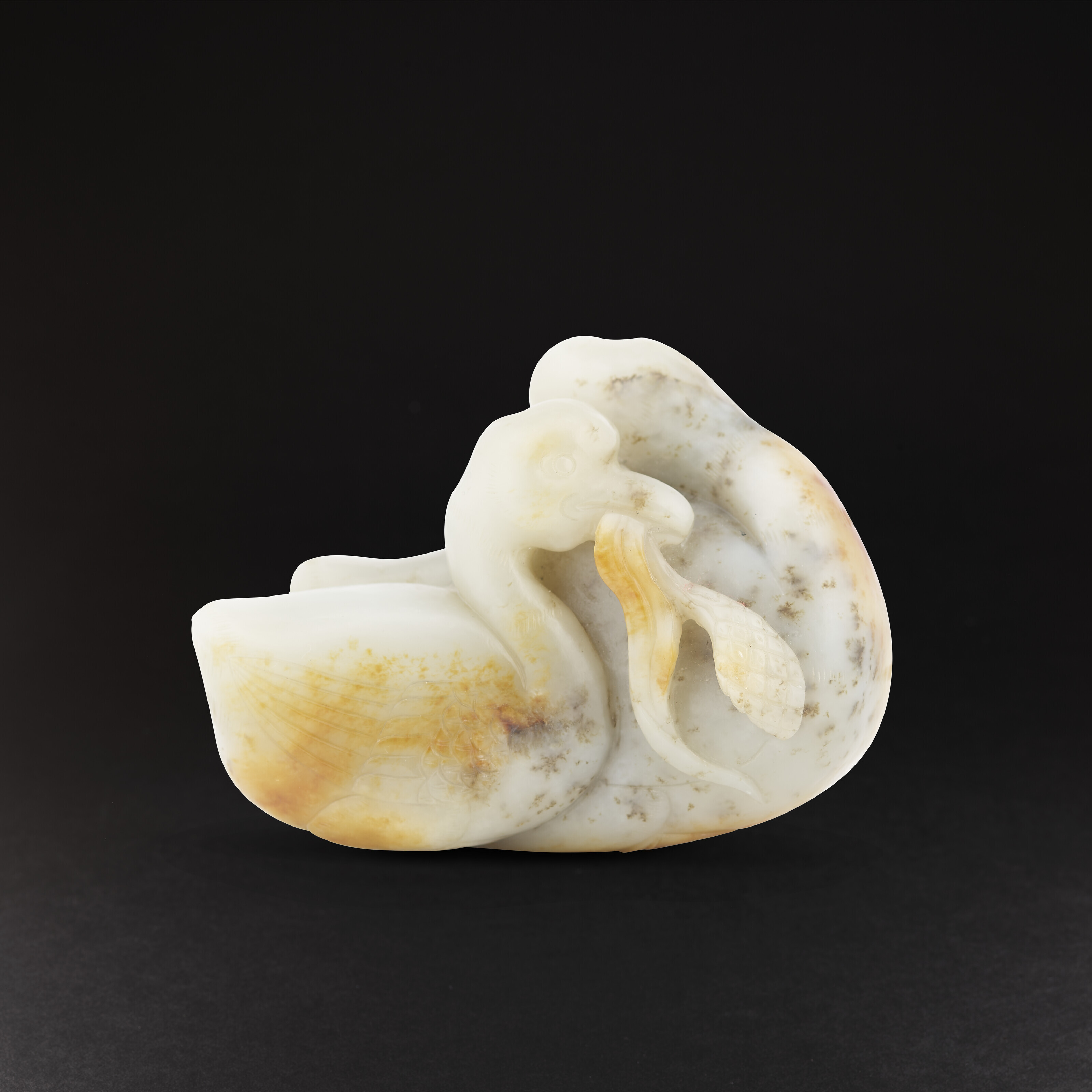 A GREYISH-WHITE AND RUSSET JADE 'MANDARIN DUCK' GROUP, | Christie’s