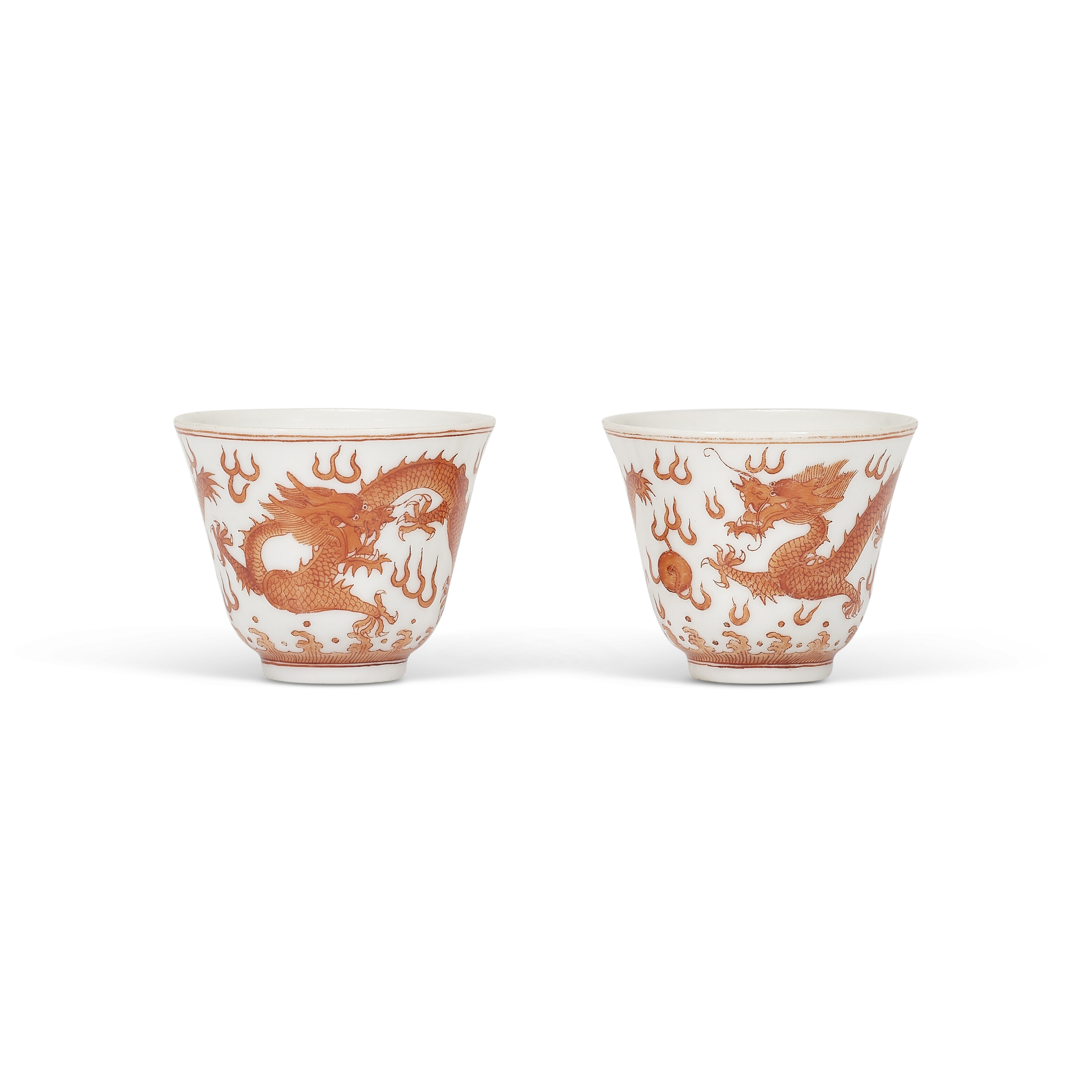 A PAIR OF IRON-RED-DECORATED ‘DRAGON’ CUPS, TONGZHI SIX-CHARACTER MARKS ...