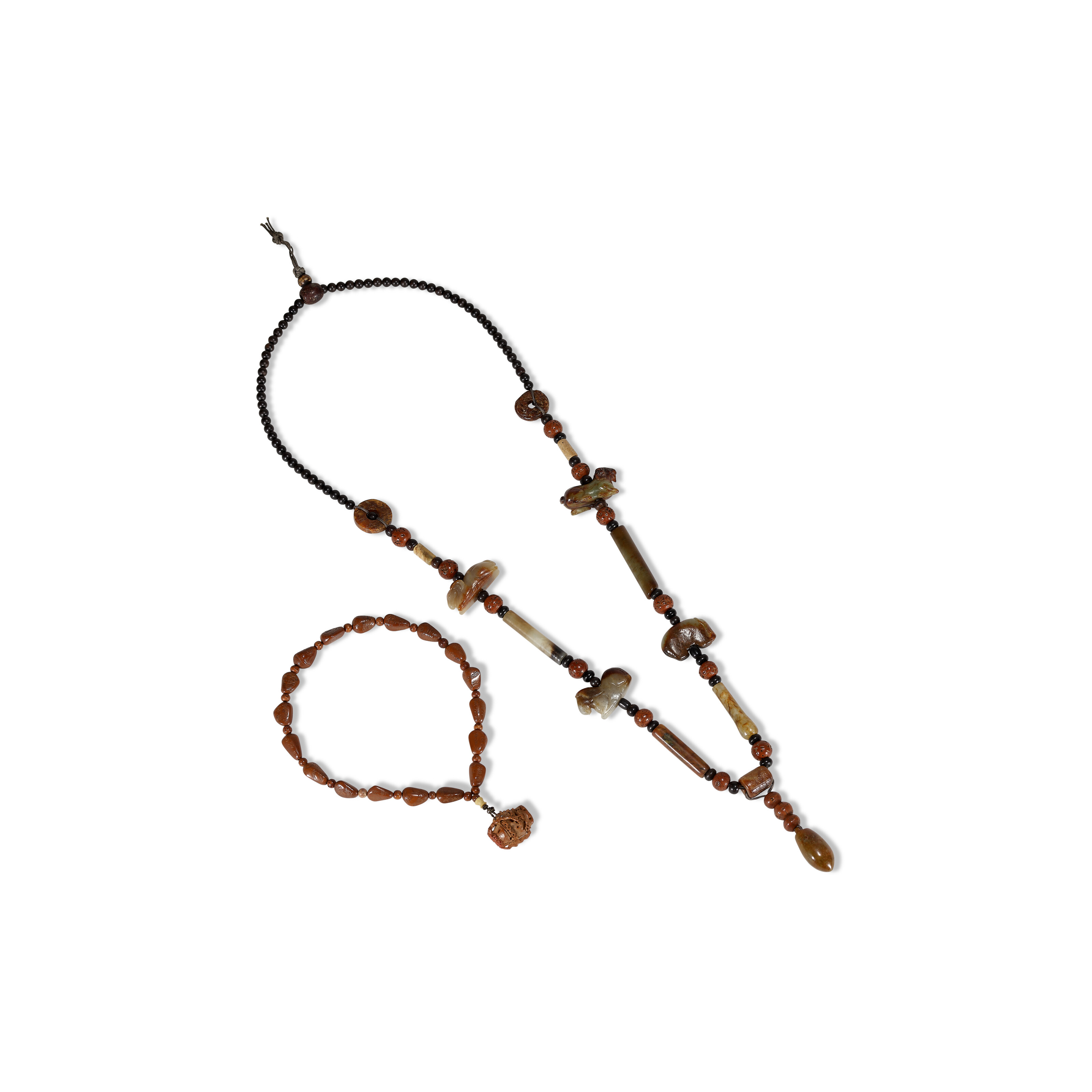 A STRING OF JADE CARVINGS AND A CARVED NUT BRACELET, | Christie’s