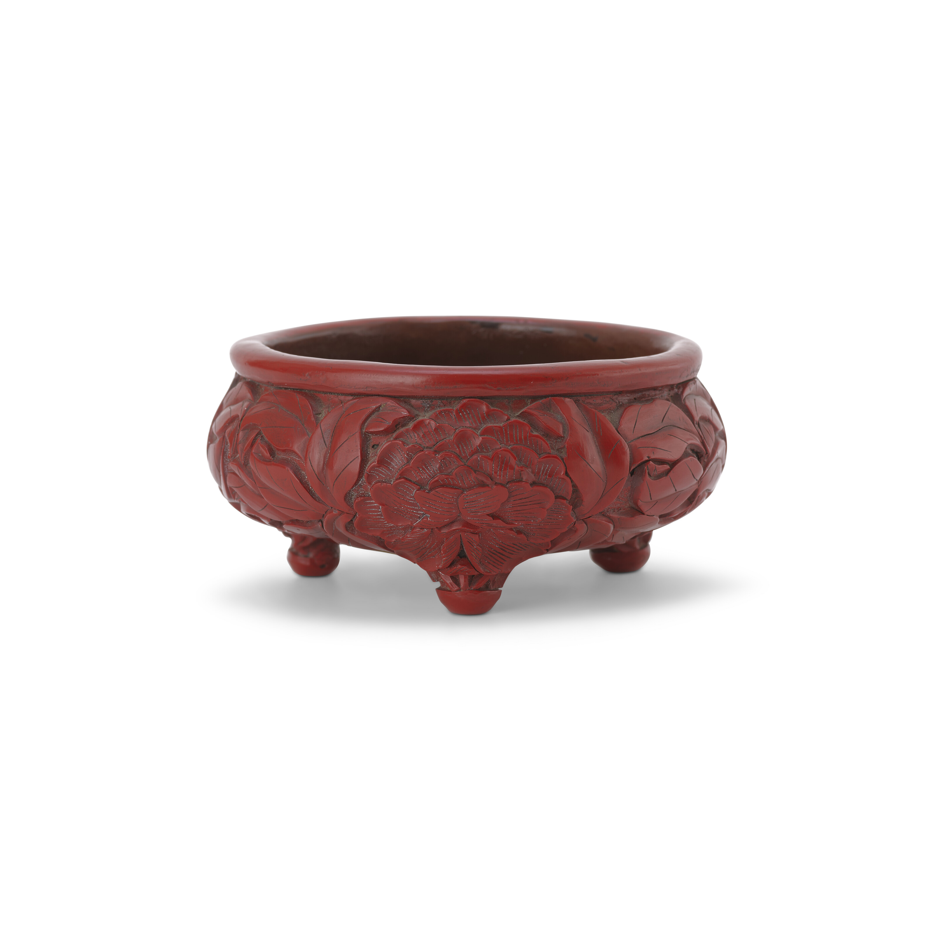 A SMALL METAL-BODIED CARVED CINNABAR LACQUER ‘PEONY’ INCENSE TRIPOD ...