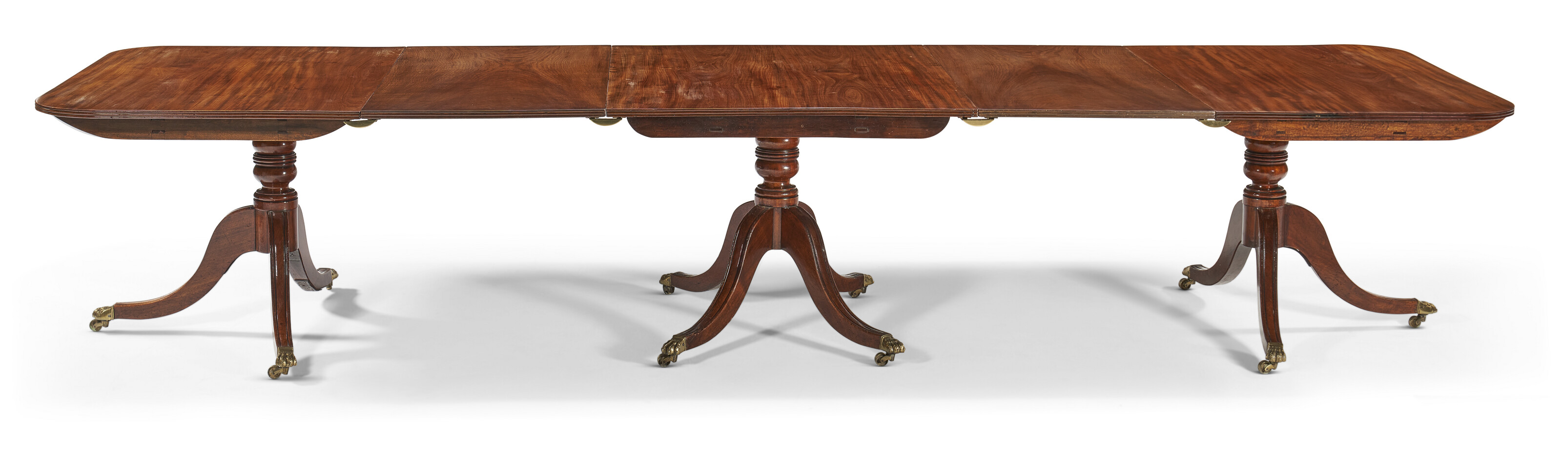 A REGENCY MAHOGANY THREE-PEDESTAL DINING TABLE, CIRCA 1800 | Christie’s