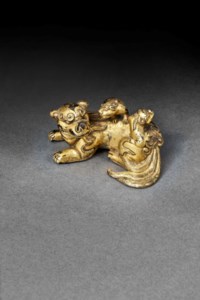 A SMALL WELL-CAST GILT-BRONZE FIGURE OF A LION WITH CUBS, MING DYNASTY ...