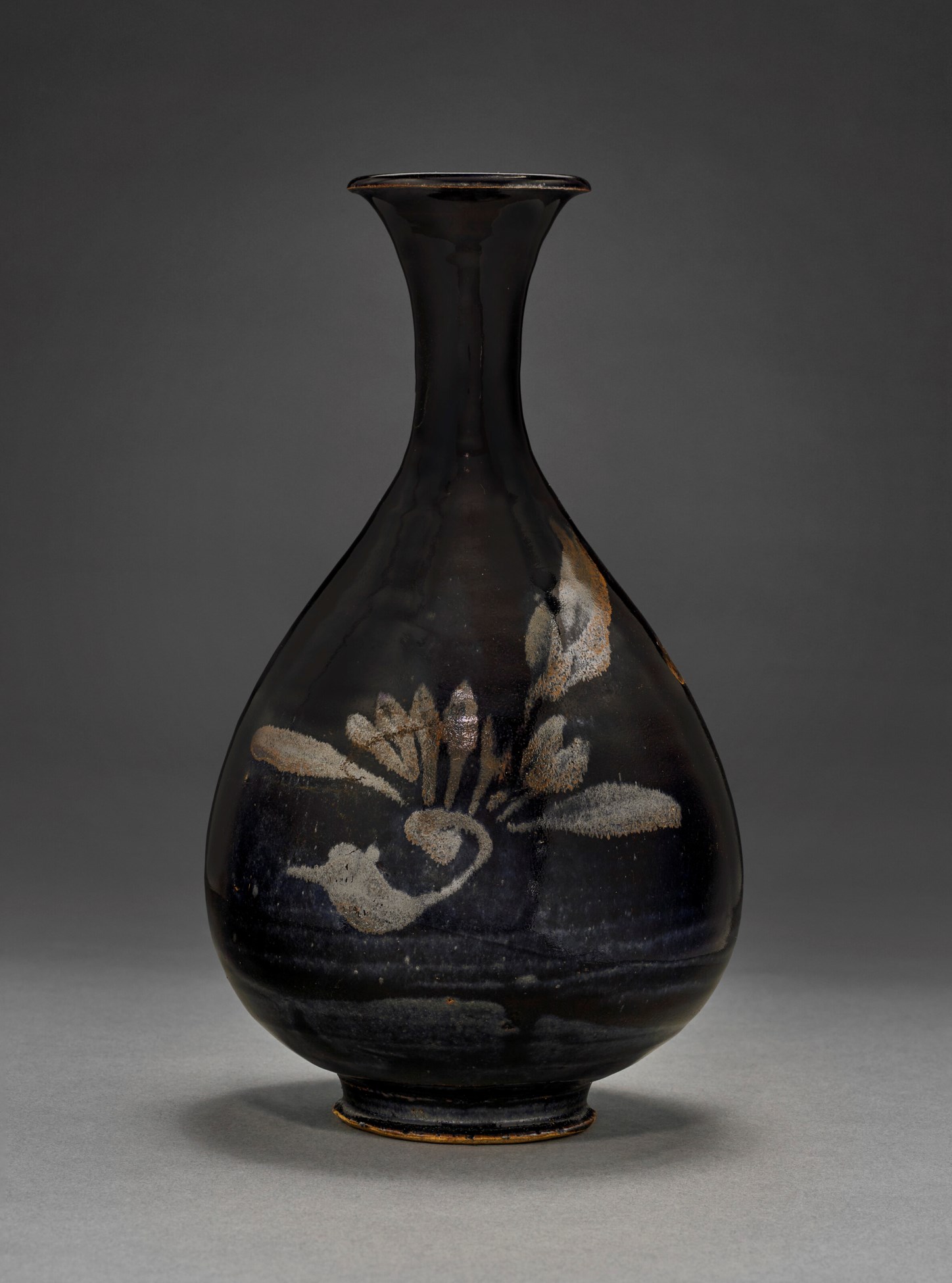 A RUSSET-PAINTED BLACK-GLAZED 'PHOENIX' BOTTLE VASE, YUHUCHUNPING, JIN ...