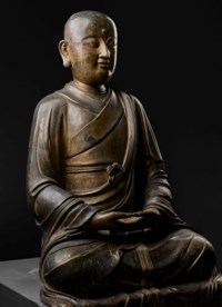 A VERY RARE AND LARGE GILT-BRONZE FIGURE OF A SEATED LUOHAN, SOUTHERN ...