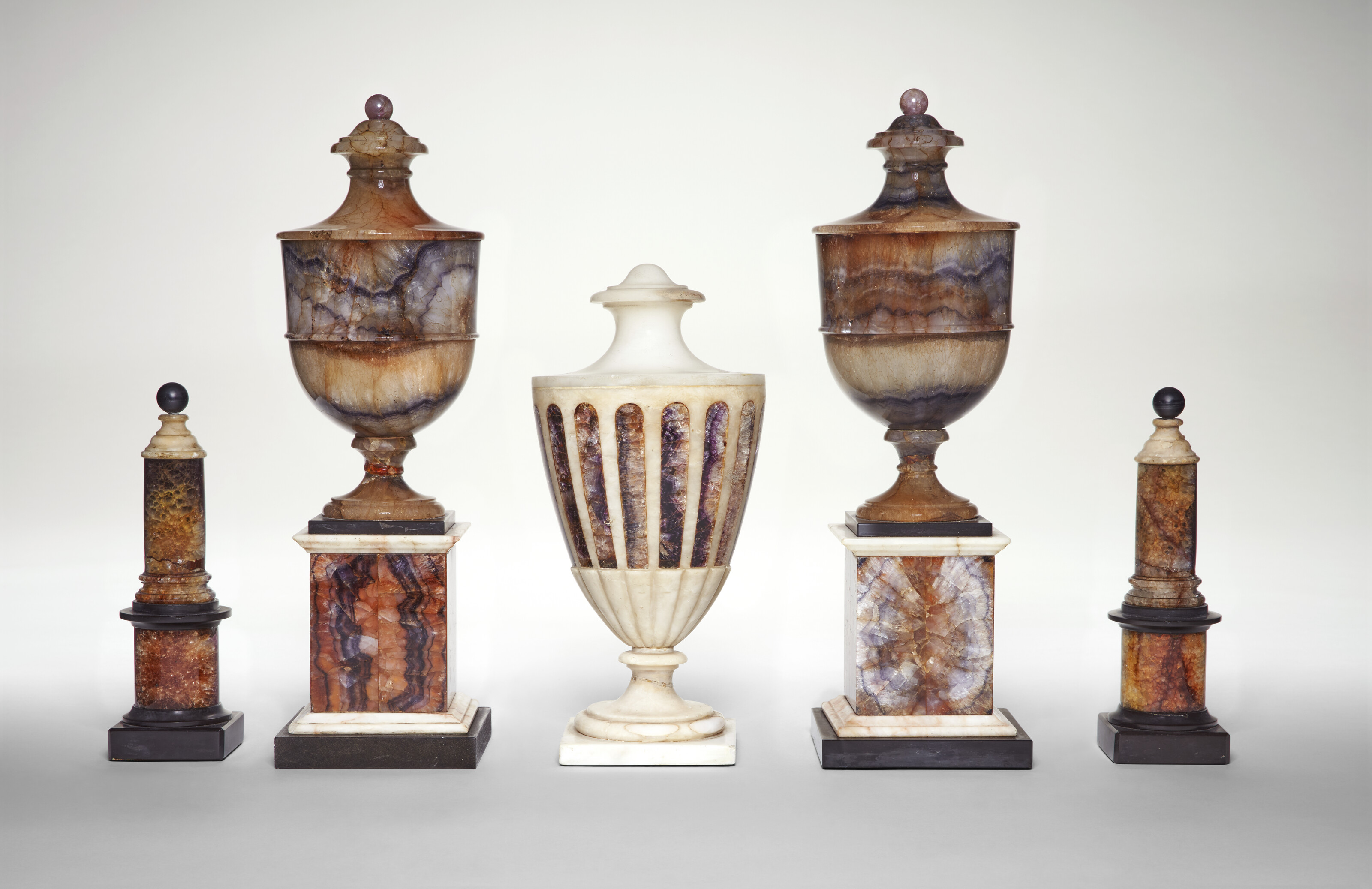 AN ASSEMBLED FIVE-PIECE BLUE JOHN, ALABASTER, AND ASHFORD BLACK MARBLE ...