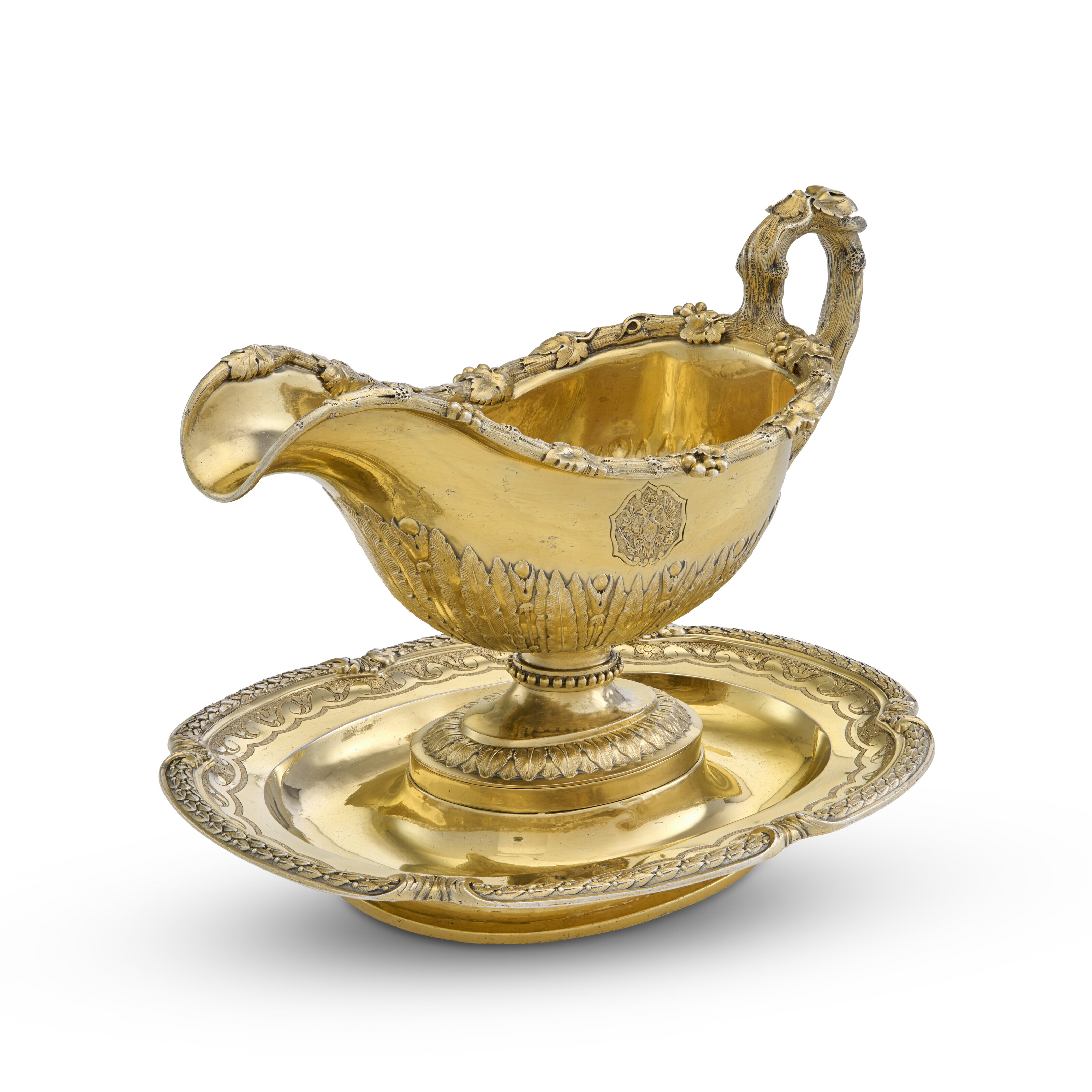 A RUSSIAN SILVER-GILT SAUCEBOAT AND STAND FROM THE ORLOFF SERVICE, BY ...