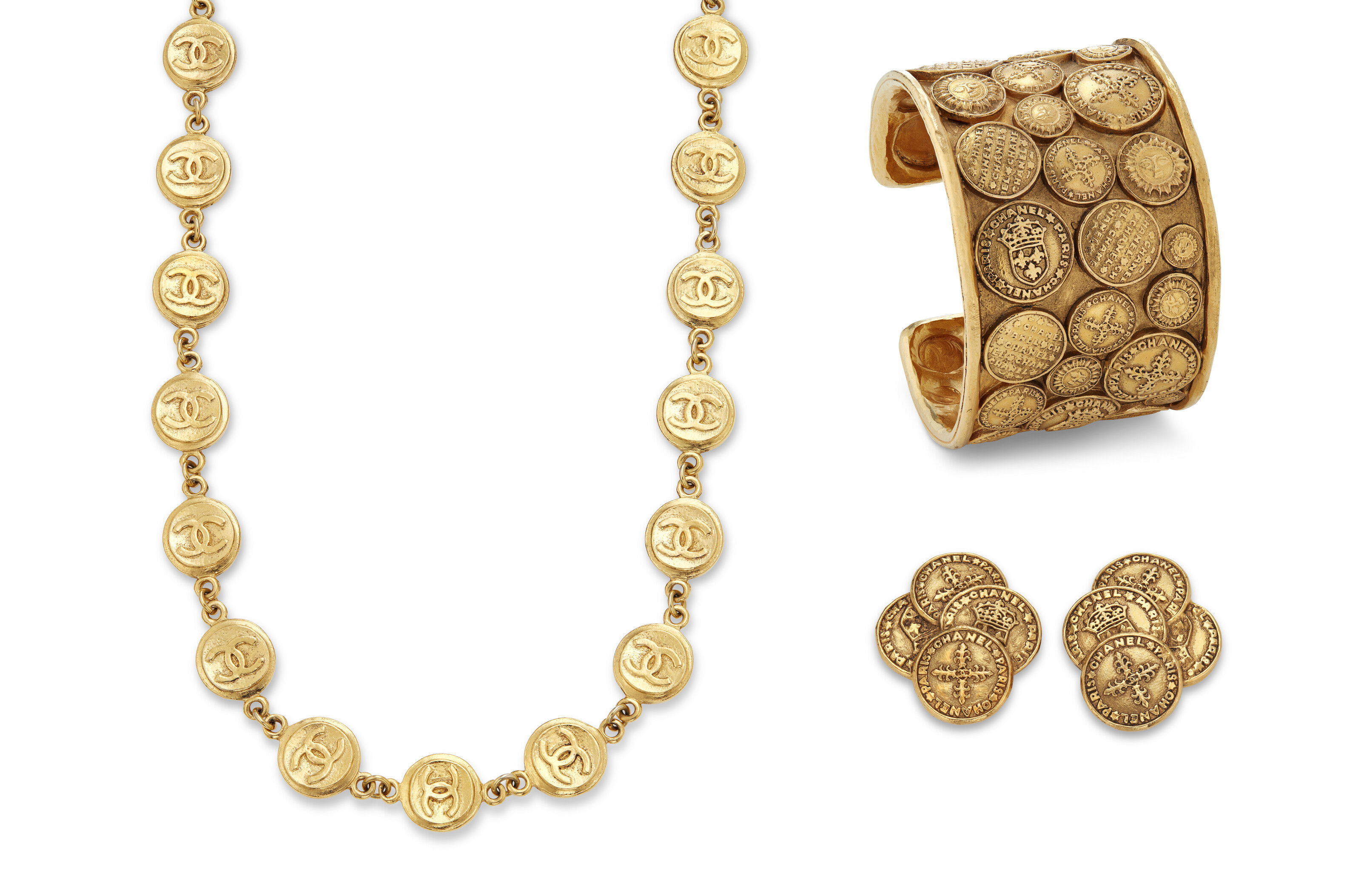 A SET OF THREE: A MEDALLION CUFF, A PAIR OF MEDALLION CLIP-ON EARRINGS ...