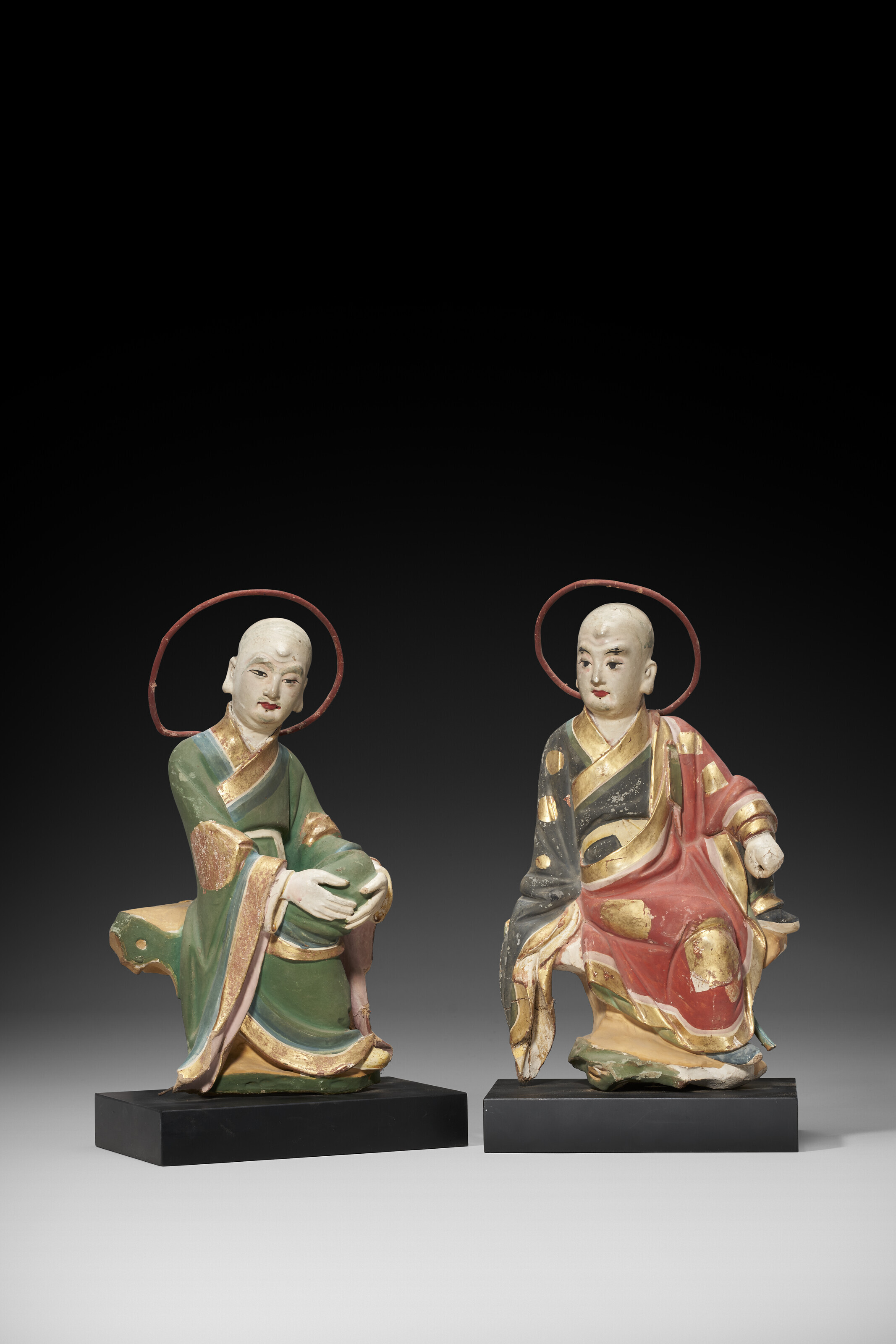 A PAIR OF POLYCHROME AND GILT-DECORATED STUCCO FIGURES OF LUOHAN, CHINA ...