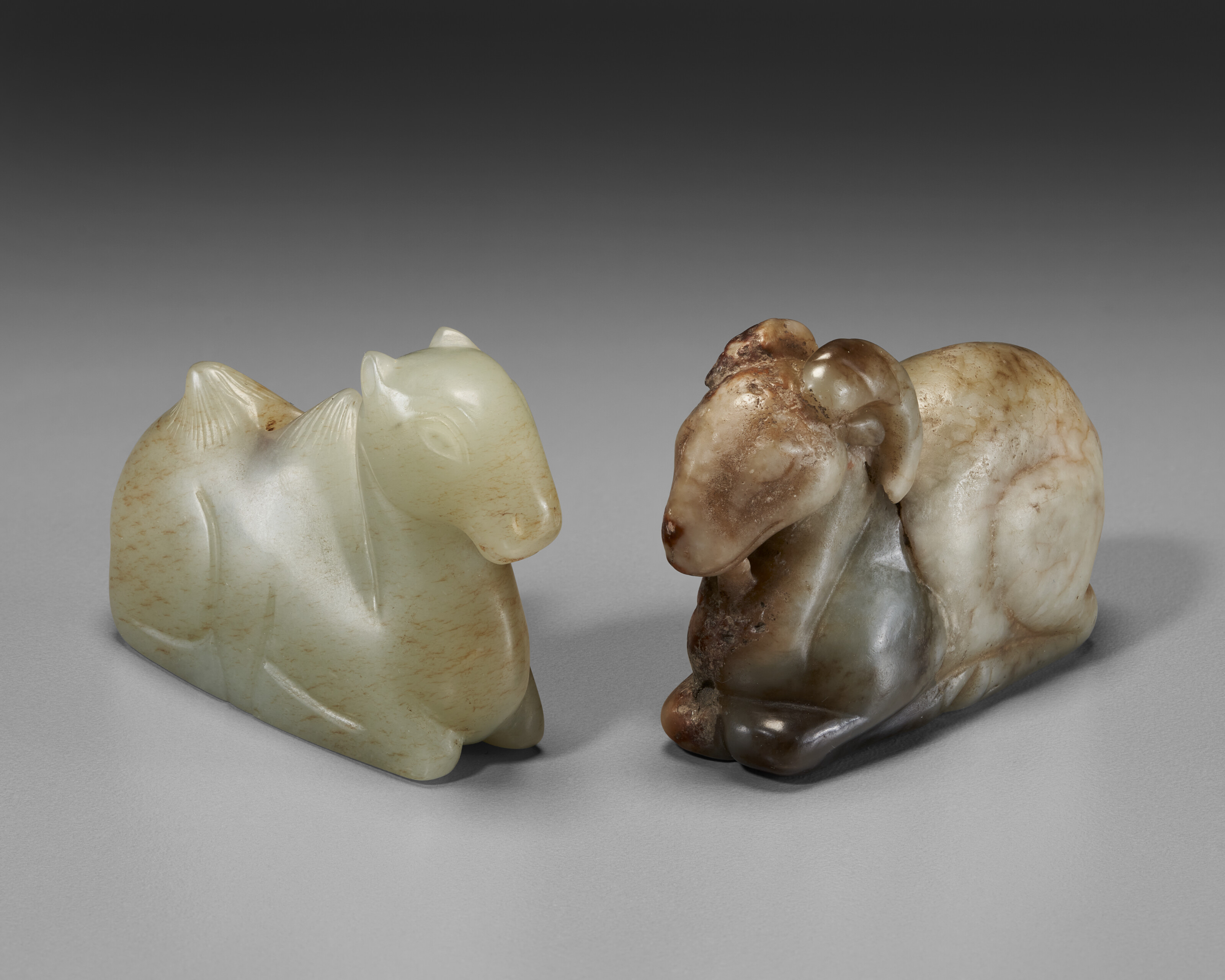 TWO JADE CARVINGS OF RECUMBENT ANIMALS, CHINA | Christie’s
