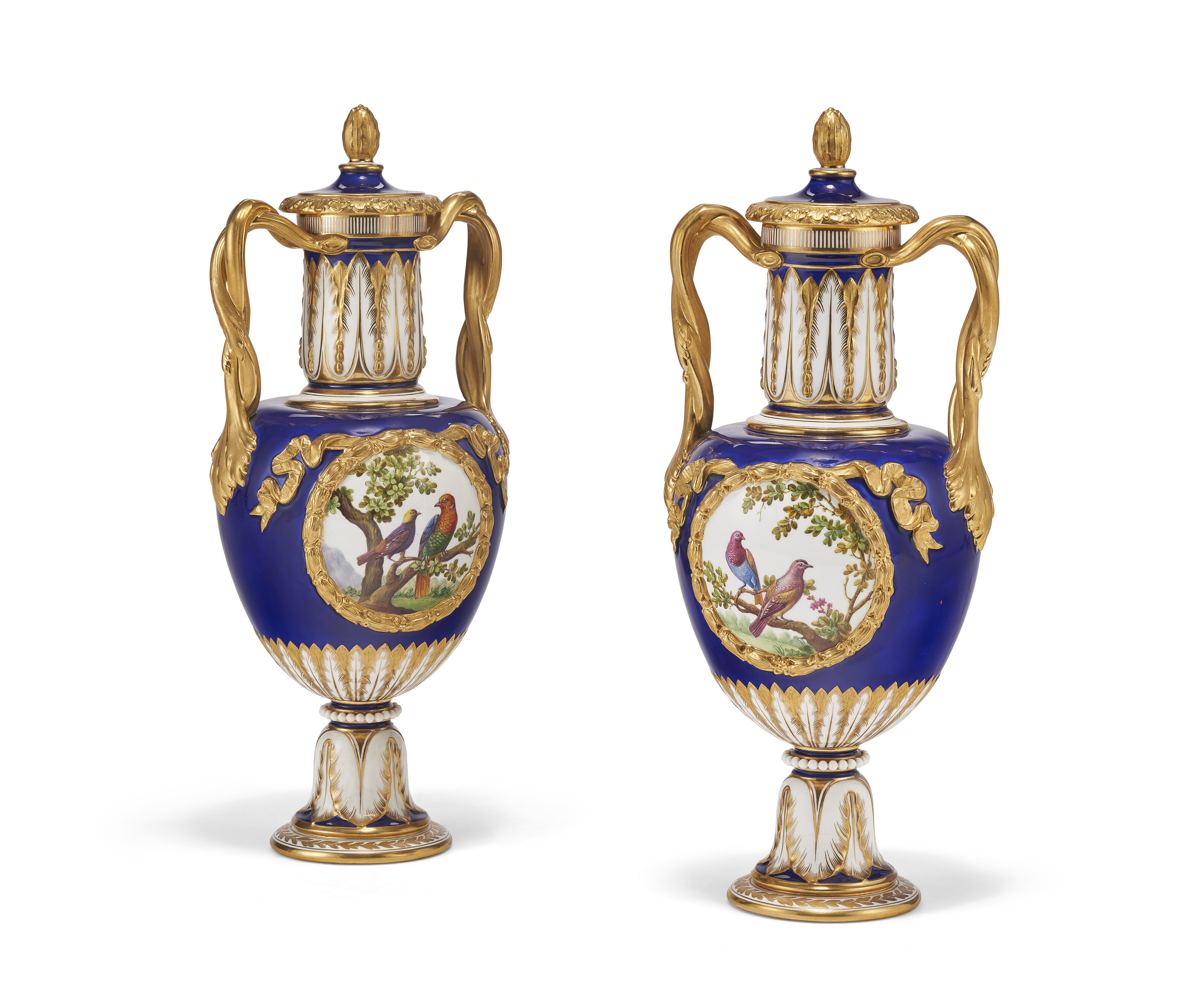 A PAIR OF MINTON PORCELAIN COBALT-BLUE GROUND VASES AND COVERS, CIRCA ...