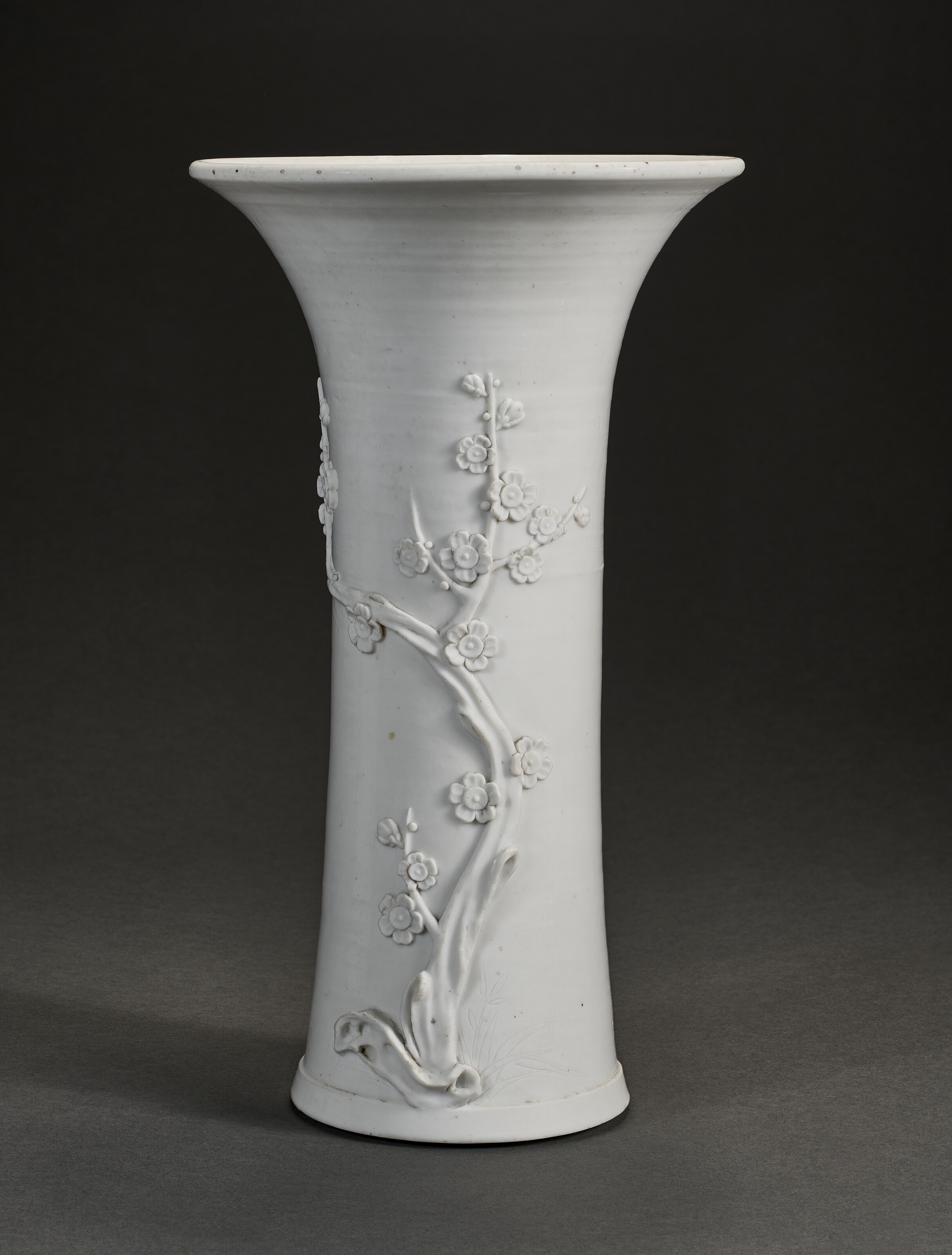 A DEHUA GU-FORM 'PRUNUS' VASE, 17TH-18TH CENTURY | Christie’s