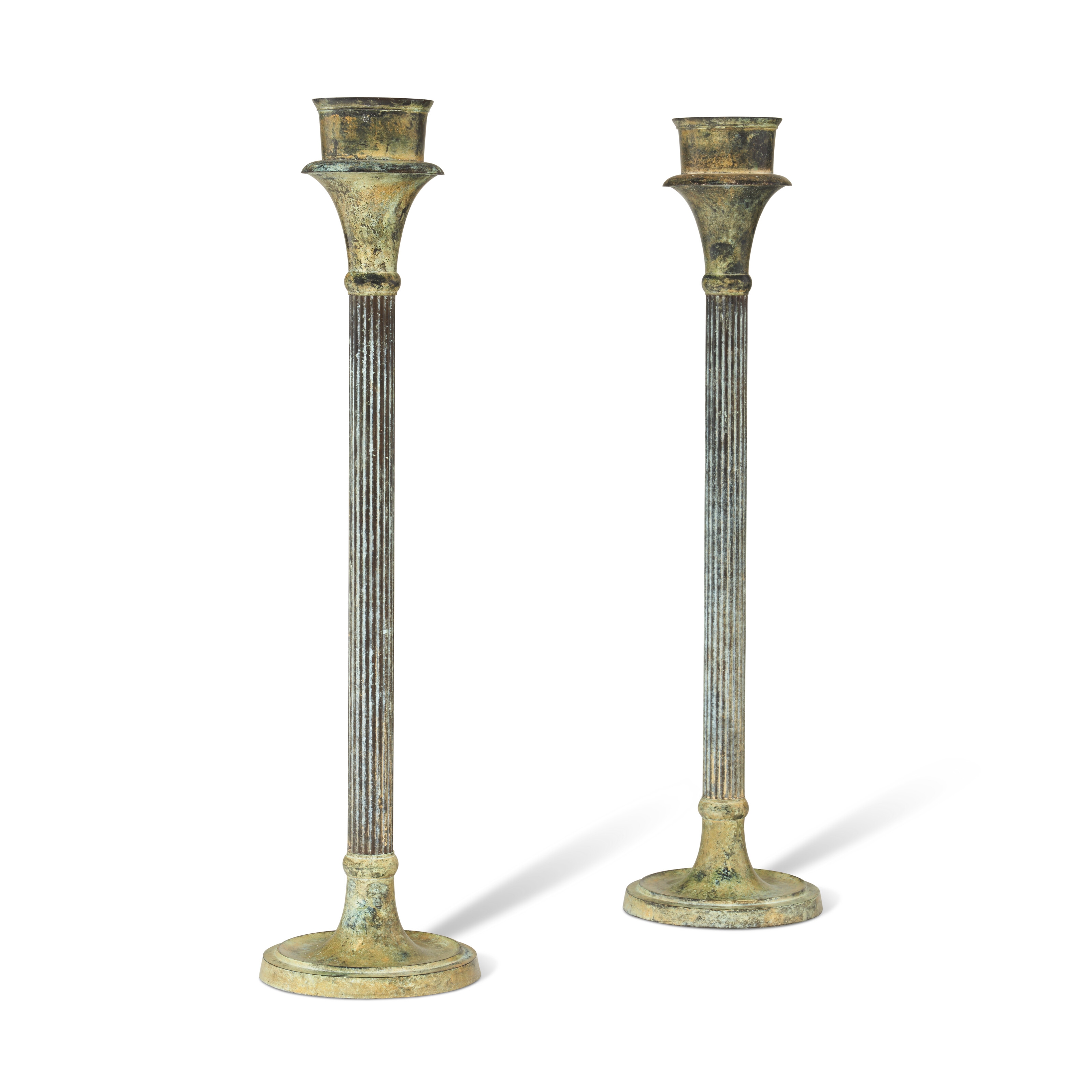 A PAIR OF PATINATED METAL CANDLESTICKS, 20TH CENTURY | Christie’s
