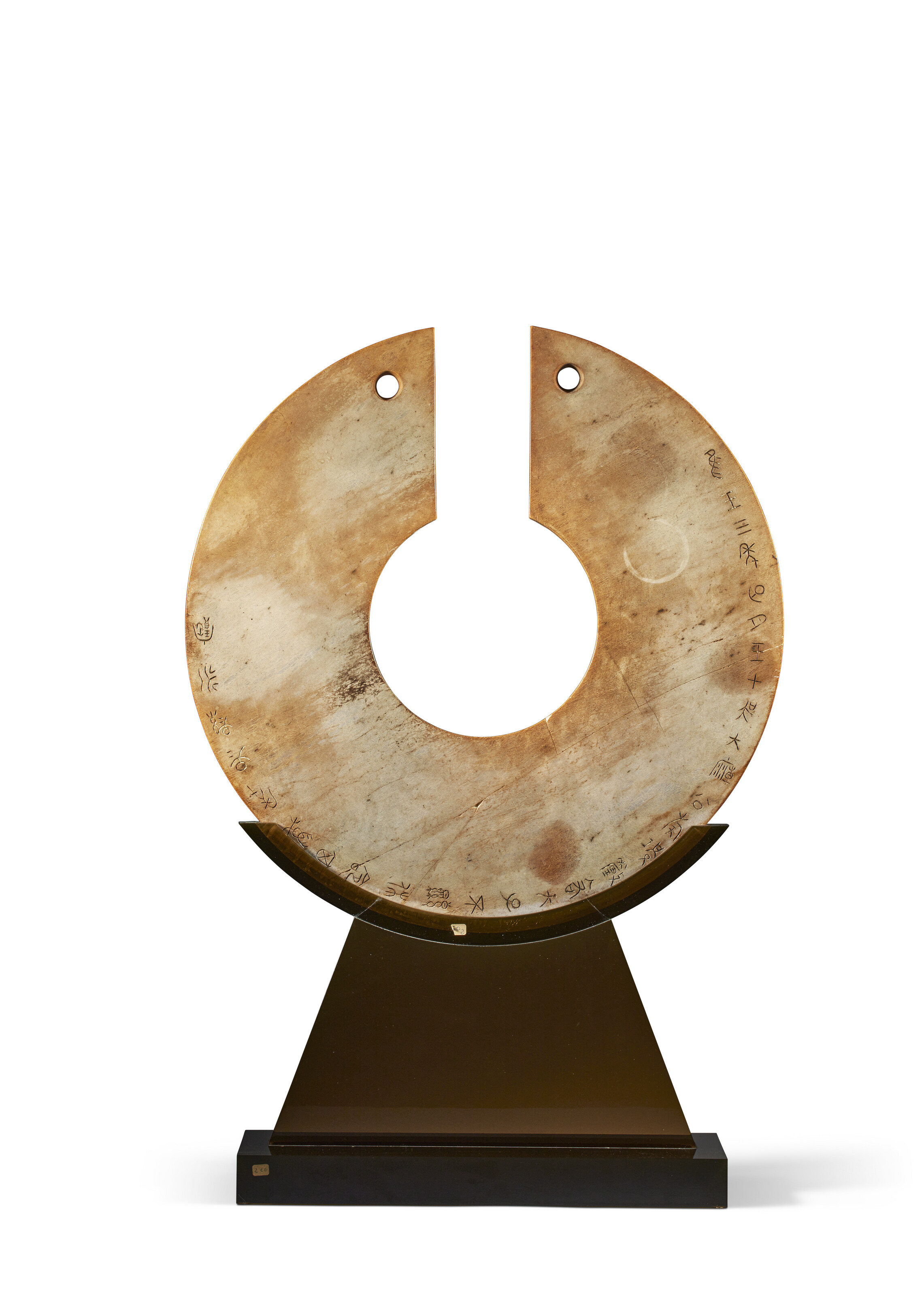 A MASSIVE MOTTLED BEIGE AND RUSSET JADE DISC, JUE, CHINA, POSSIBLE HAN ...