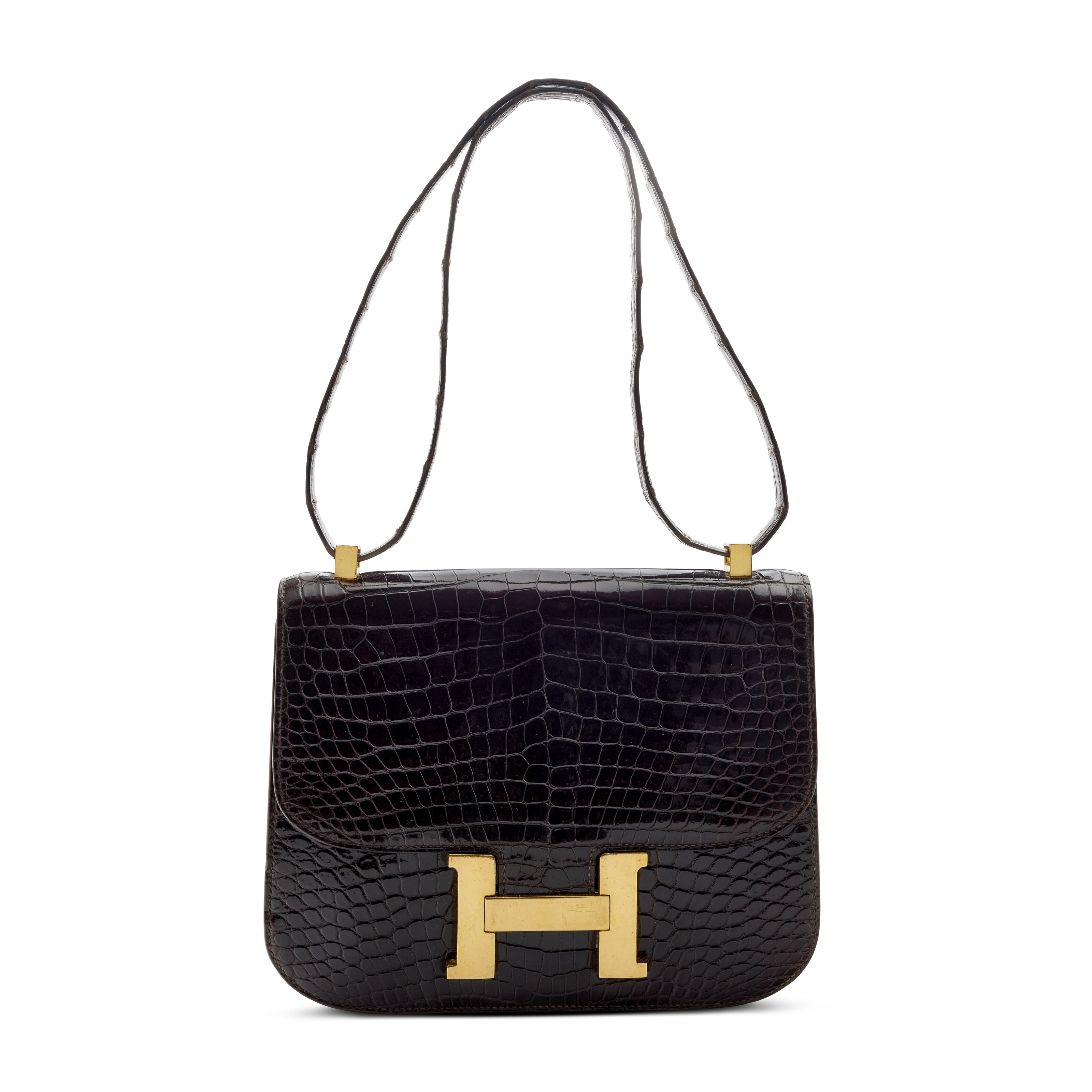 A SHINY MARRON FONCÉ POROSUS CROCODILE CONSTANCE 23 WITH GOLD HARDWARE ...