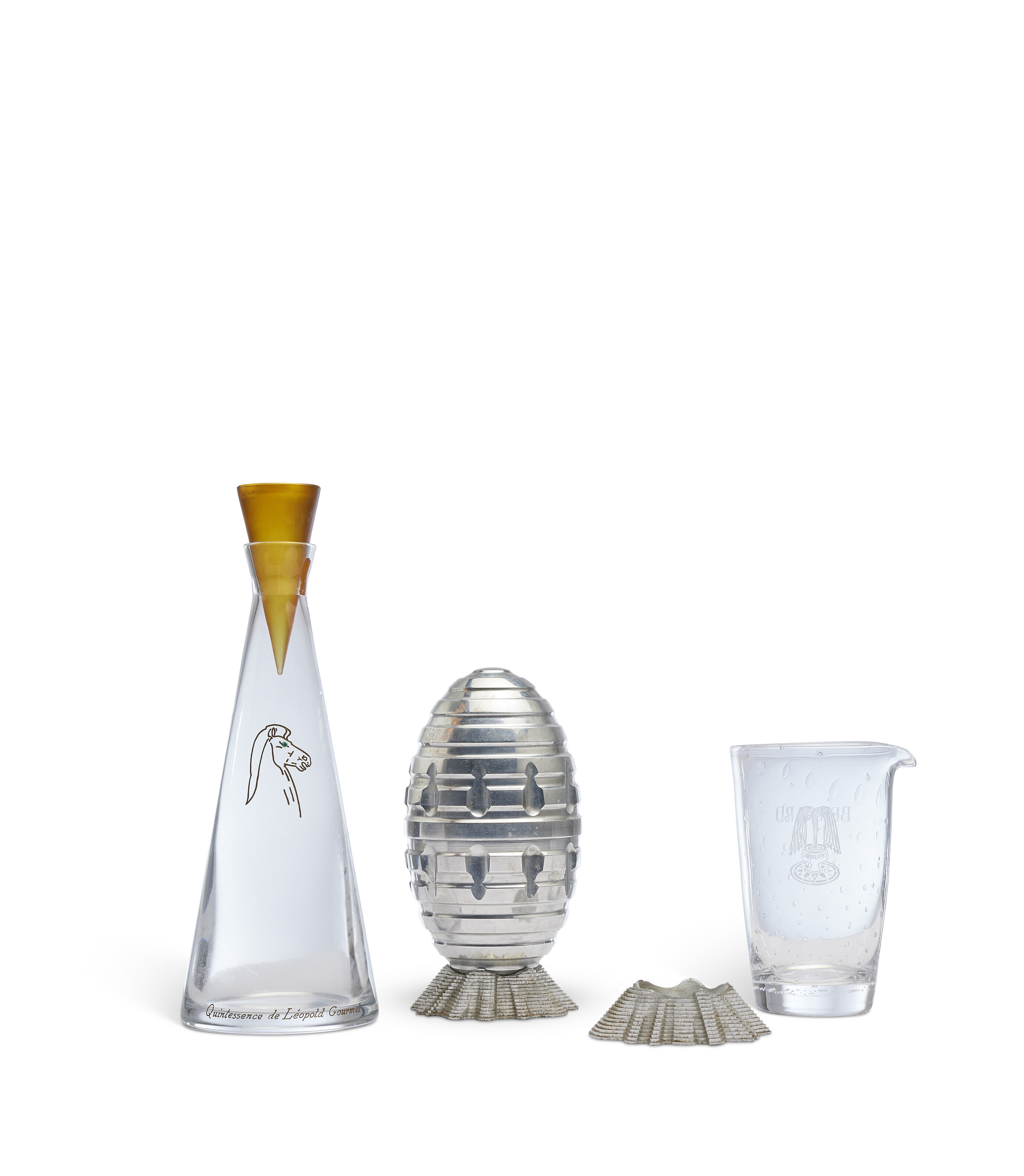 UN SHAKER EN FORME D'ŒUF ET DEUX SUPPORTS EN MÉTAL, XXE SIÈCLE | Christie’s