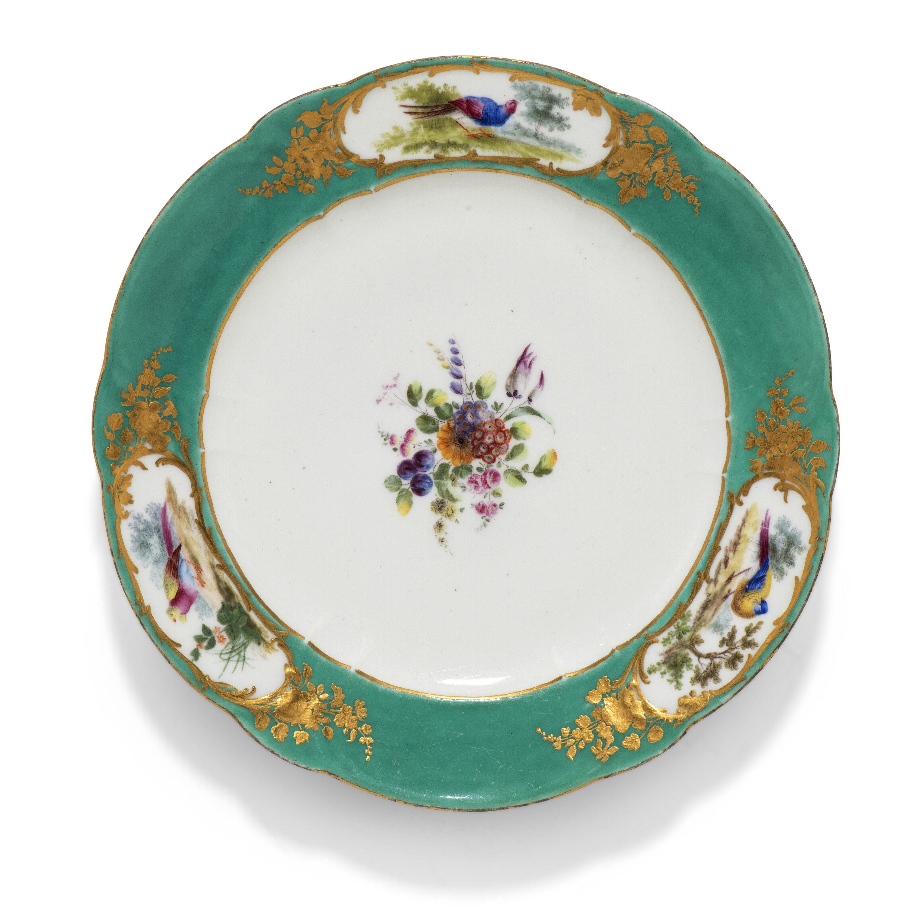 A SEVRES PORCELAIN GREEN-GROUND PLATE (ASSIETTE A PALMES), CIRCA 1757 ...