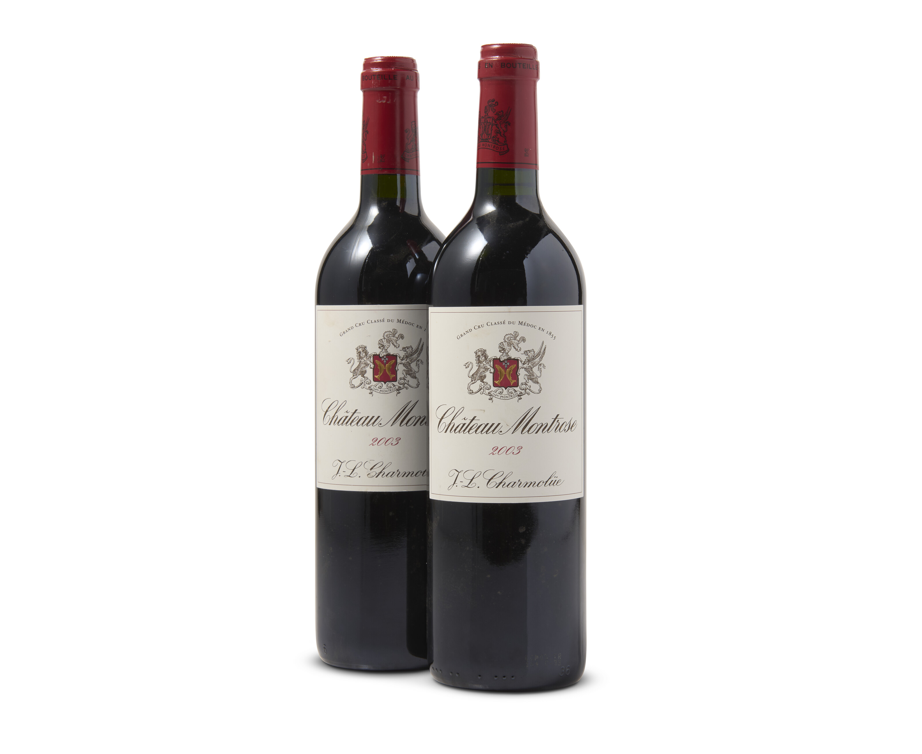 Château Montrose 2003, Slightly scuffed capsules. Slightly bin-soiled ...