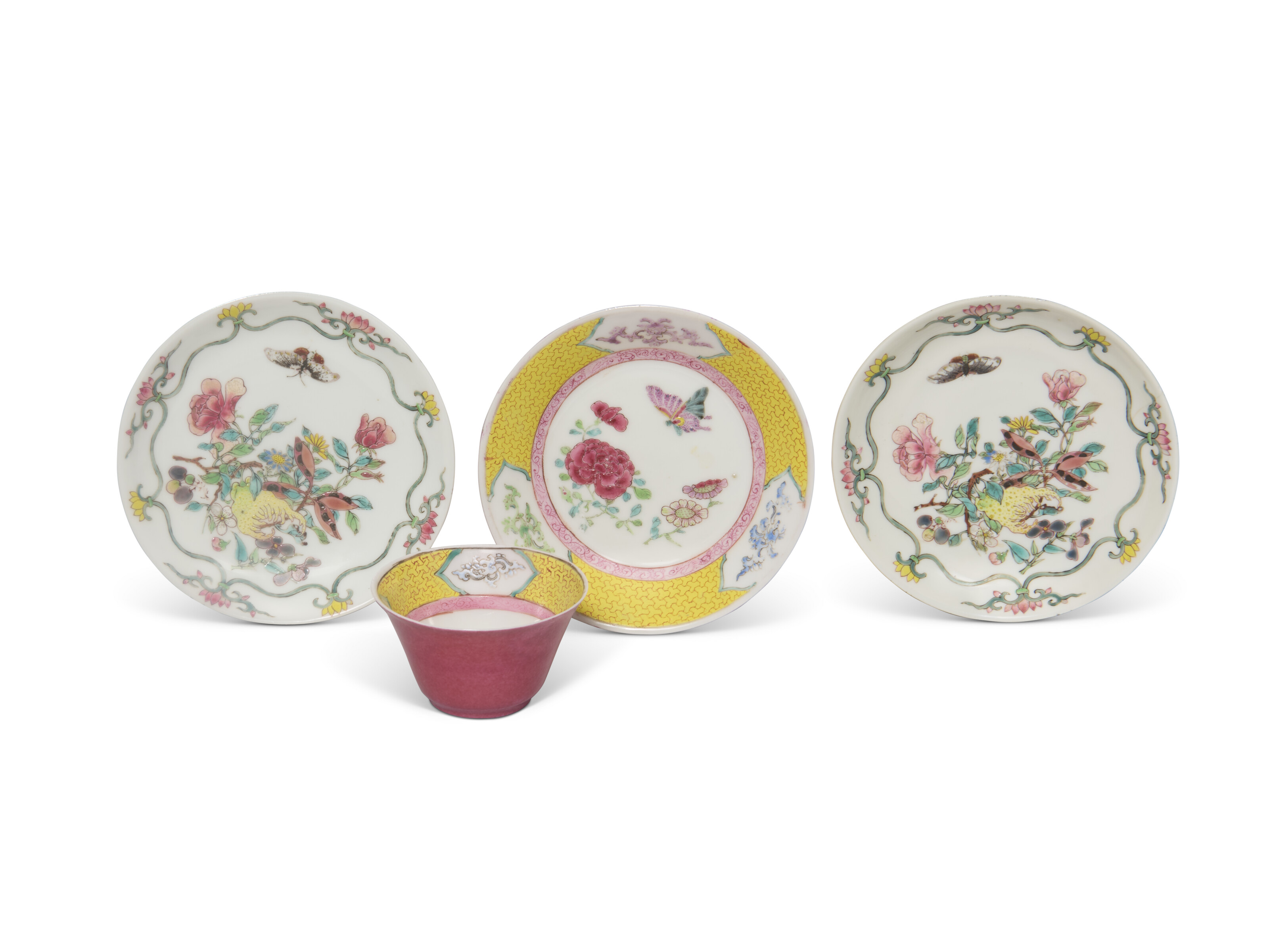 A RUBY-GROUND FAMILLE ROSE TEA BOWL AND SAUCER AND A PAIR OF FAMILLE ...