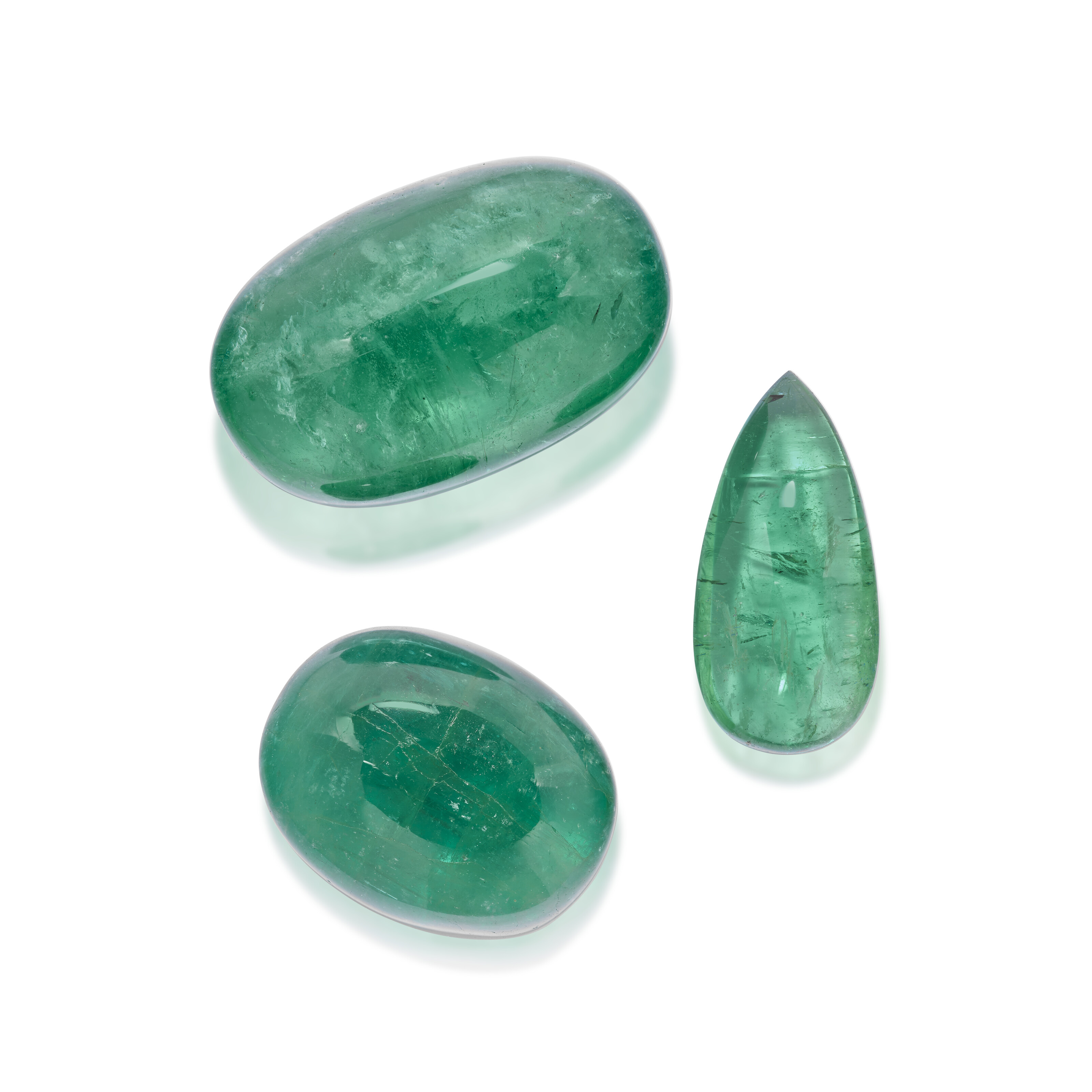 GROUP OF THREE UNMOUNTED EMERALDS, | Christie’s