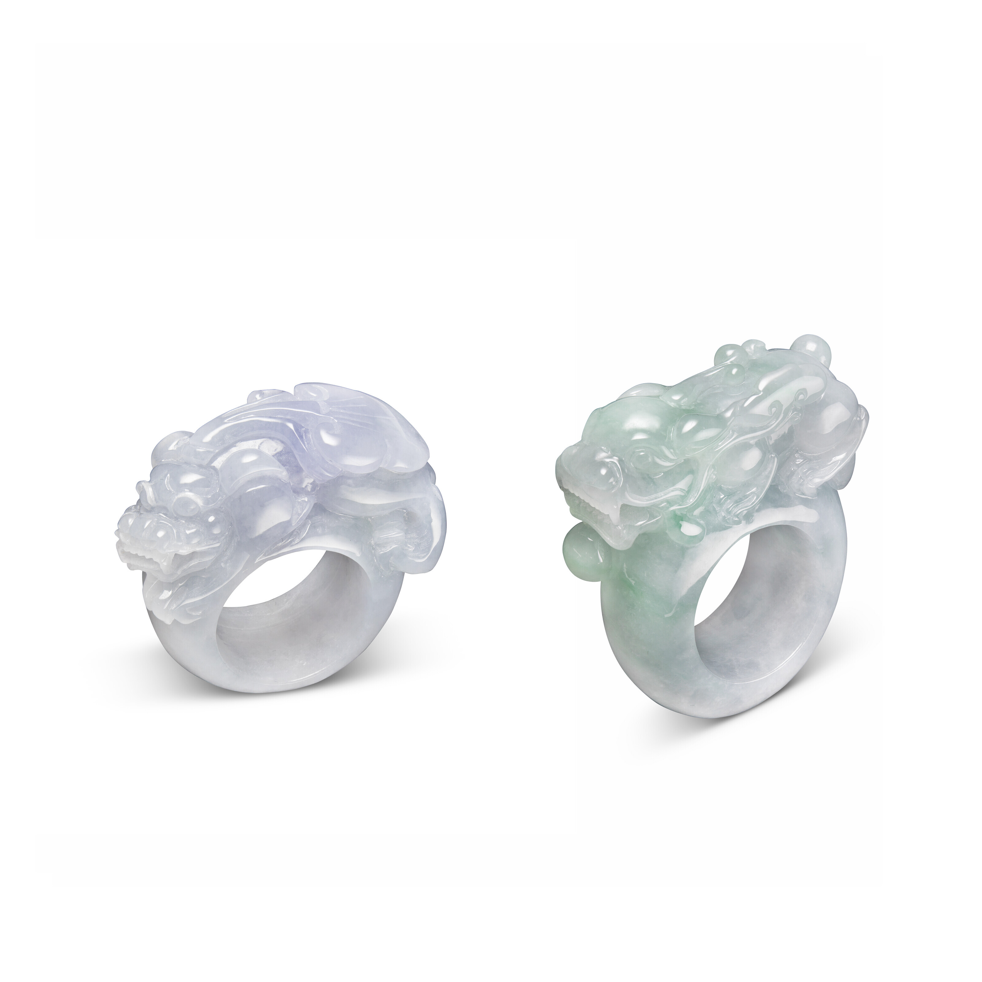 NO RESERVE – PAIR OF CARVED JADEITE SADDLE RINGS, | Christie’s