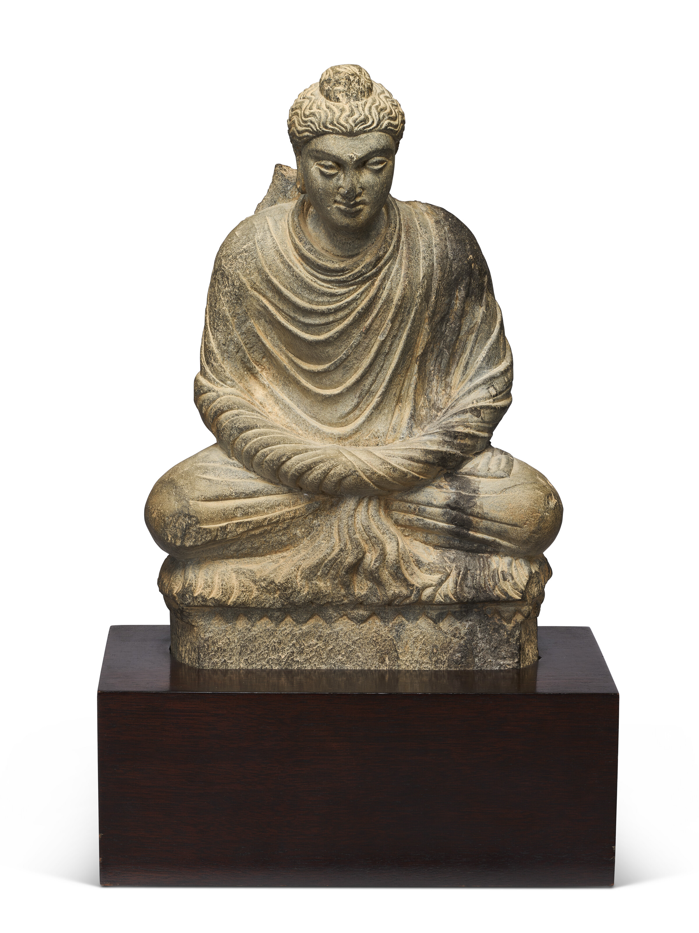 A GREY SCHIST FIGURE OF SEATED BUDDHA, ANCIENT REGION OF GANDHARA, 3RD-4TH CENTURY CE | Christie’s
