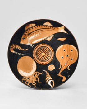 AN APULIAN RED-FIGURED FISH-PLATE, ATTRIBUTED TO THE PERRONE-PHRIXOS ...