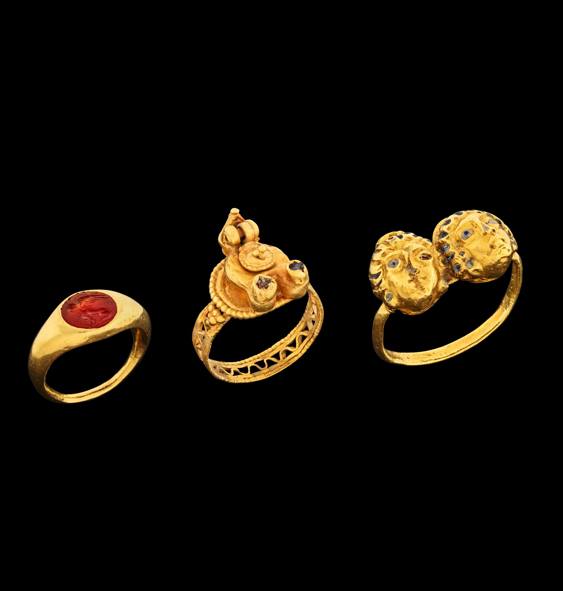 TWO ROMAN GOLD FINGER RINGS AND A ROMAN GOLD AND CARNELIAN FINGER RING ...