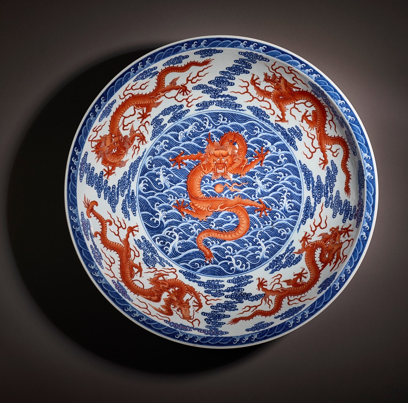 A MAGNIFICENT LARGE BLUE AND WHITE AND IRON-RED 'DRAGON' DISH, QIANLONG ...