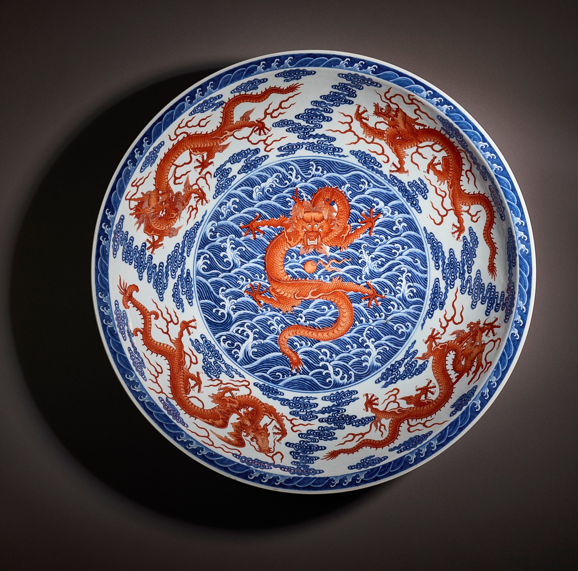 A MAGNIFICENT LARGE BLUE AND WHITE AND IRON-RED 'DRAGON' DISH, QIANLONG ...