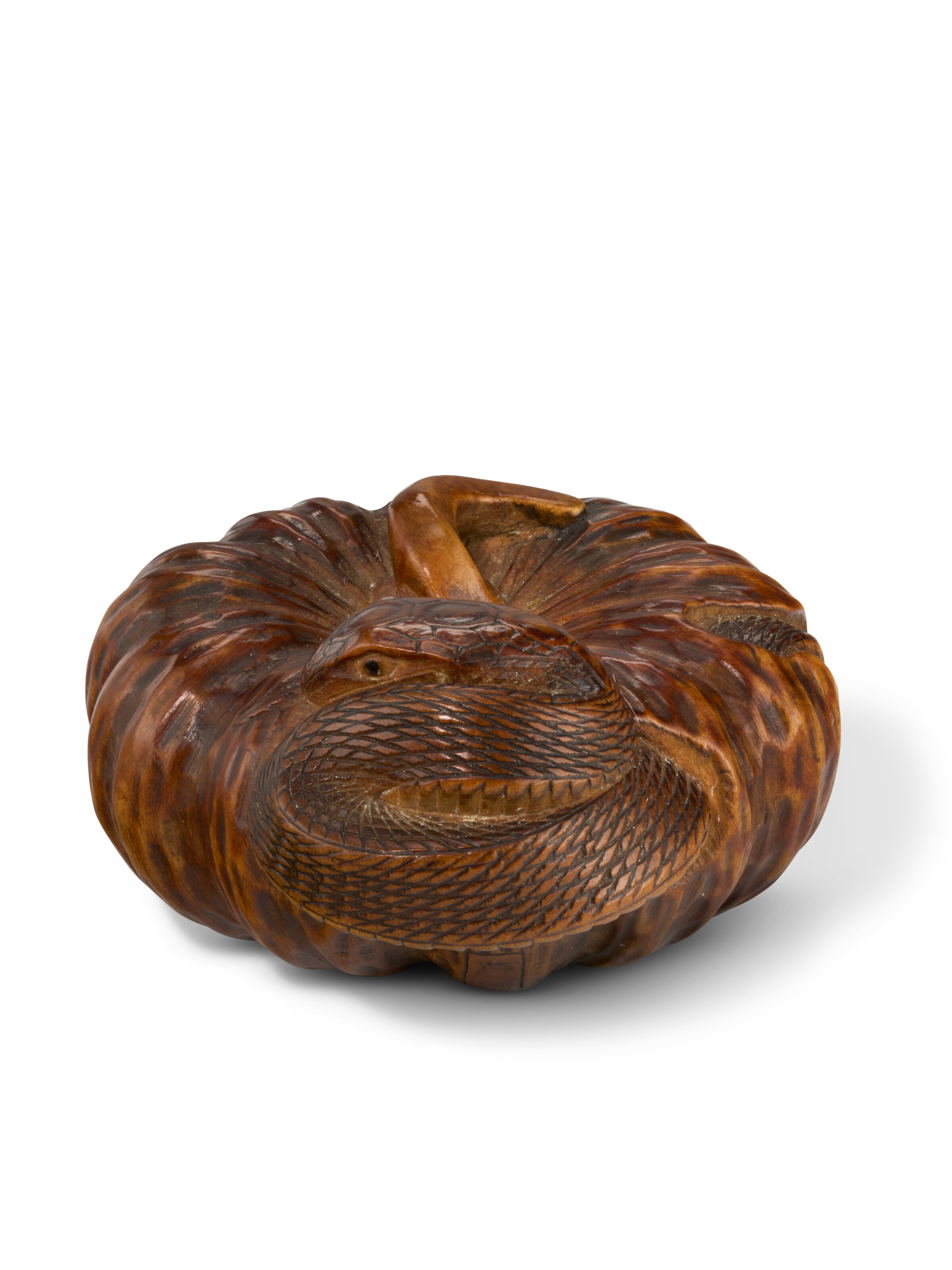 A WOOD CARVED NETSUKE OF SNAKE EMERGING FROM A PUMPKIN, JAPAN, EDO ...