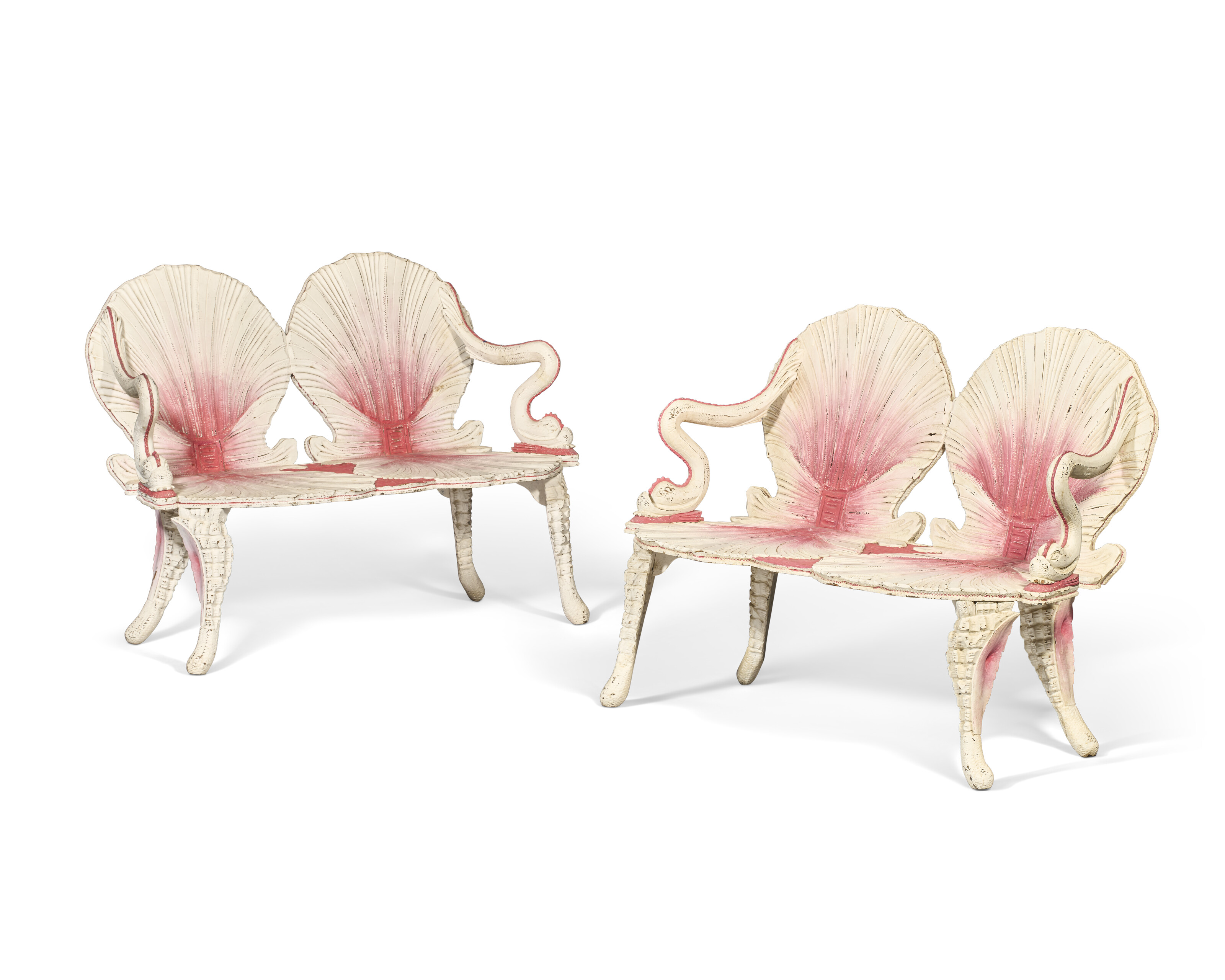 A PAIR OF CREAM AND PINK PAINTED 'GROTTO-STYLE' SHELL-FORM BENCHES ...