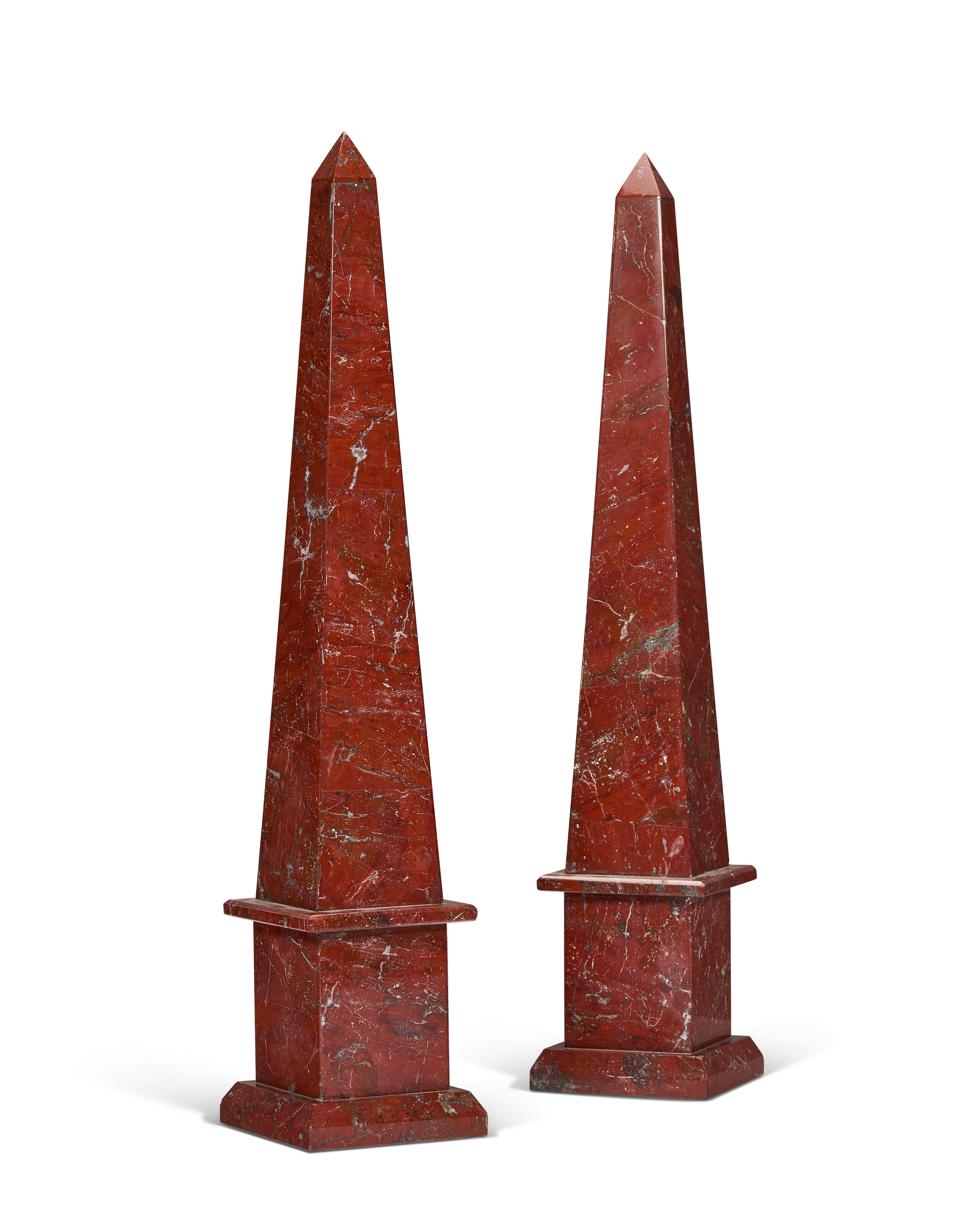 A PAIR OF LARGE RED MARBLE OBELISKS, 20TH CENTURY | Christie’s