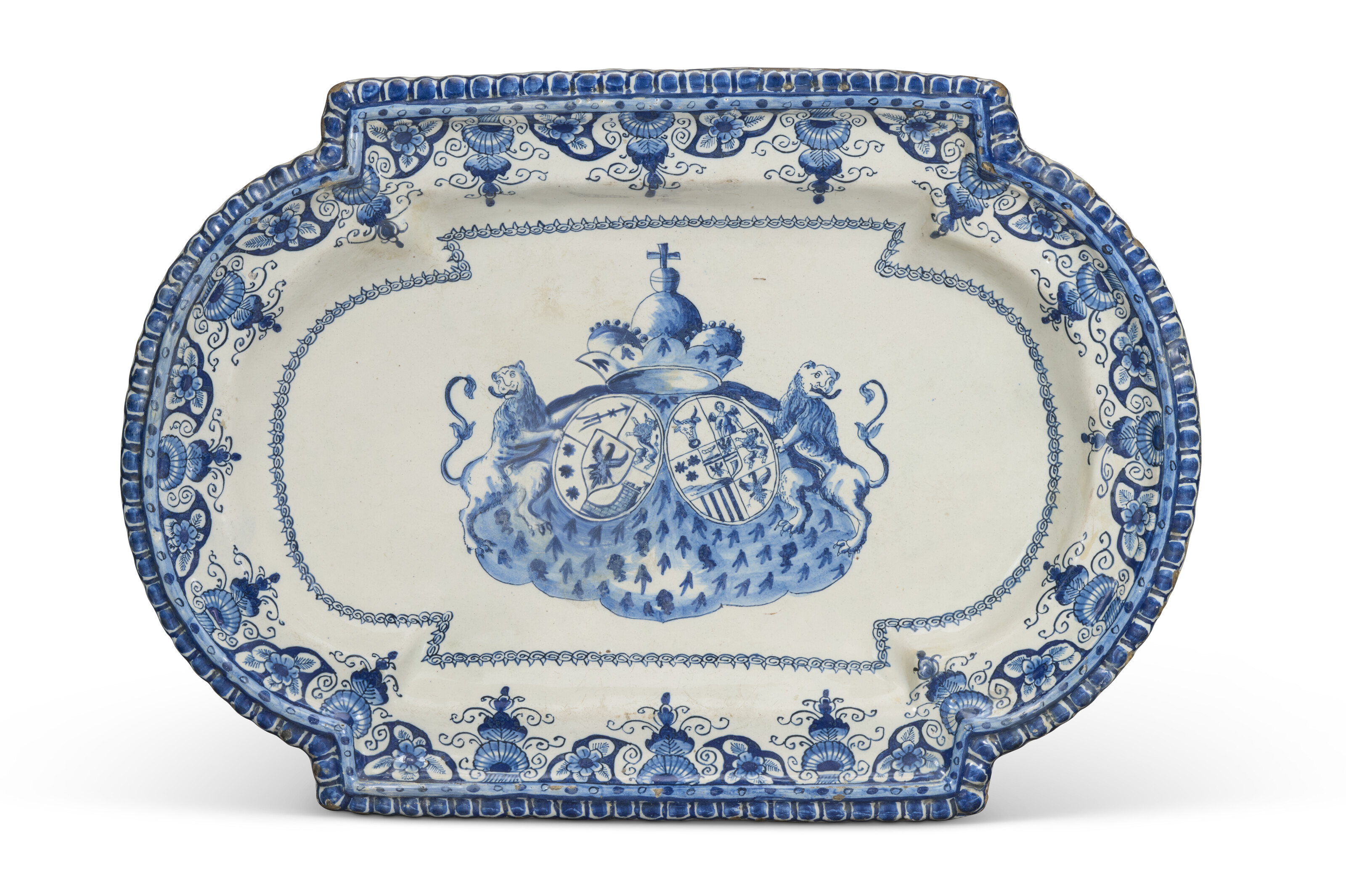 A DUTCH DELFT BLUE AND WHITE ARMORIAL SHAPED PLATTER, CIRCA 1691-1700 ...