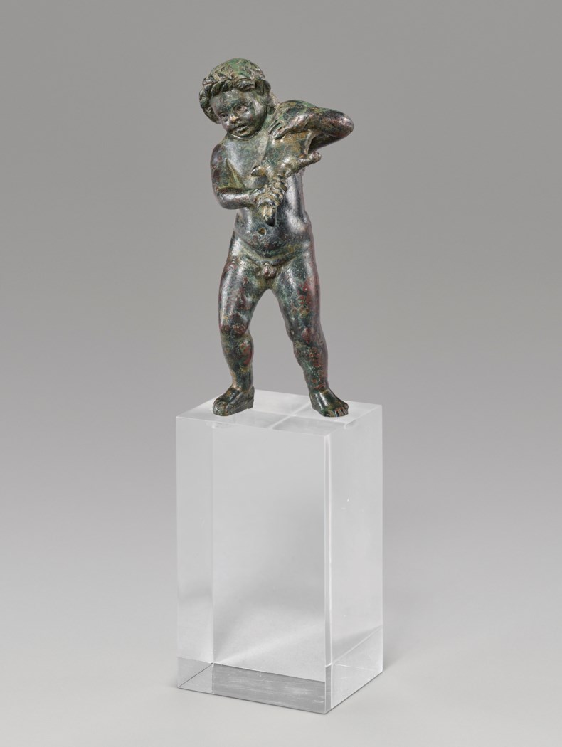 A ROMAN BRONZE SATYR SHOULDERING A WINESKIN, CIRCA 1ST CENTURY A.D ...