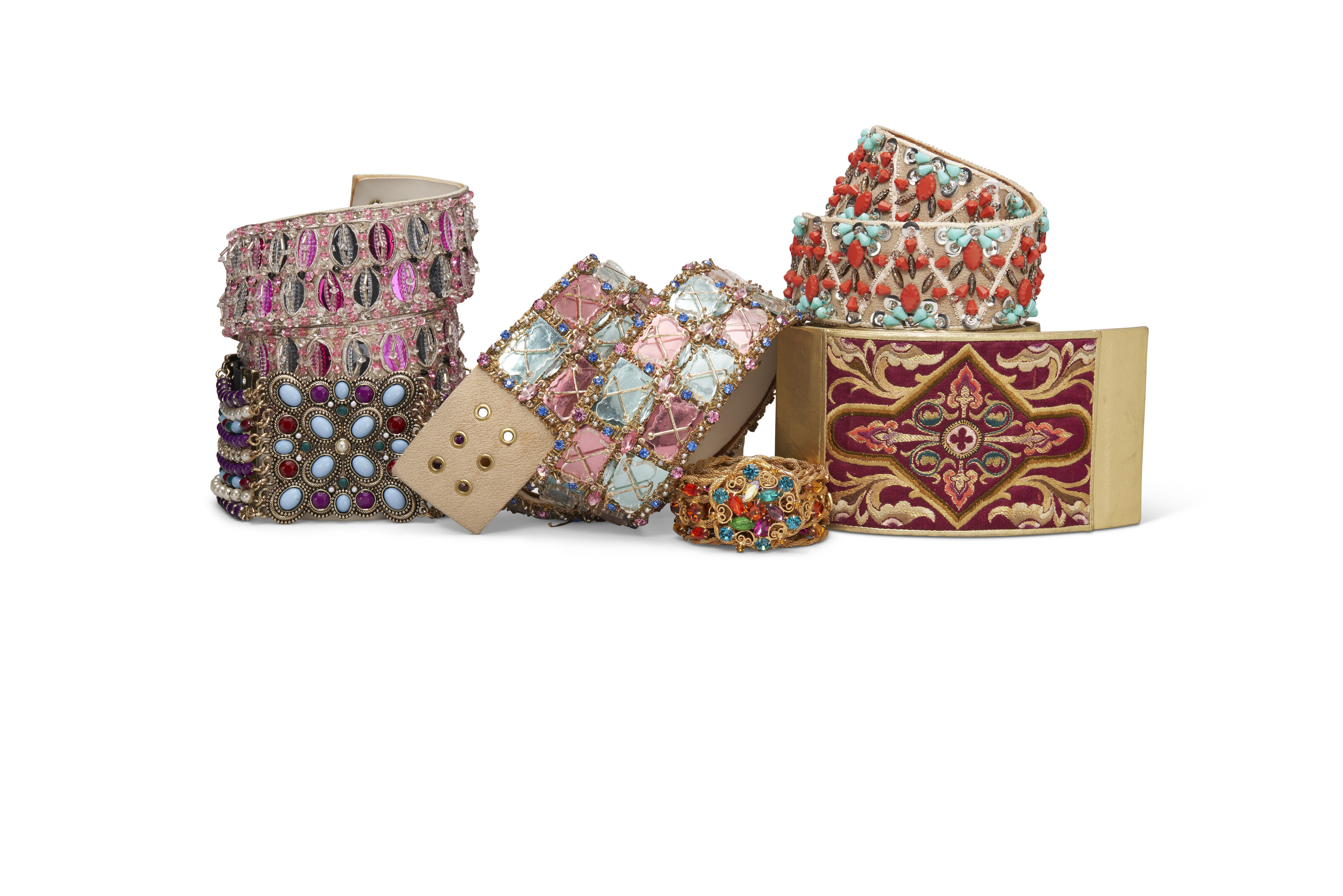 A GROUP OF EMBROIDERED AND STONE-EMBELLISHED BELTS, LABELED MALCOLM ...