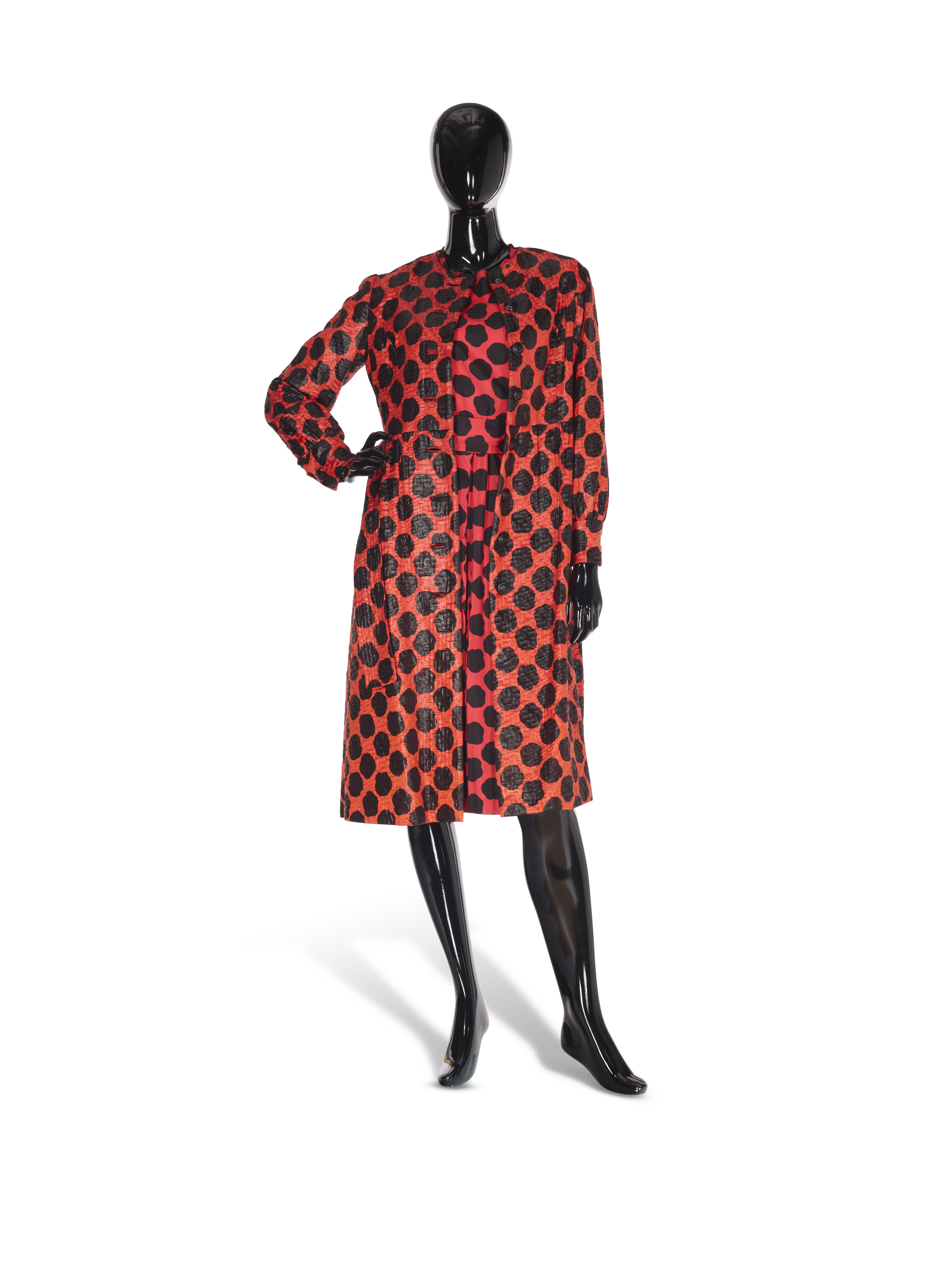 A RED GROUND AND BLACK POLKA DOT TWO-PIECE DRESS ENSEMBLE, LABELED ...