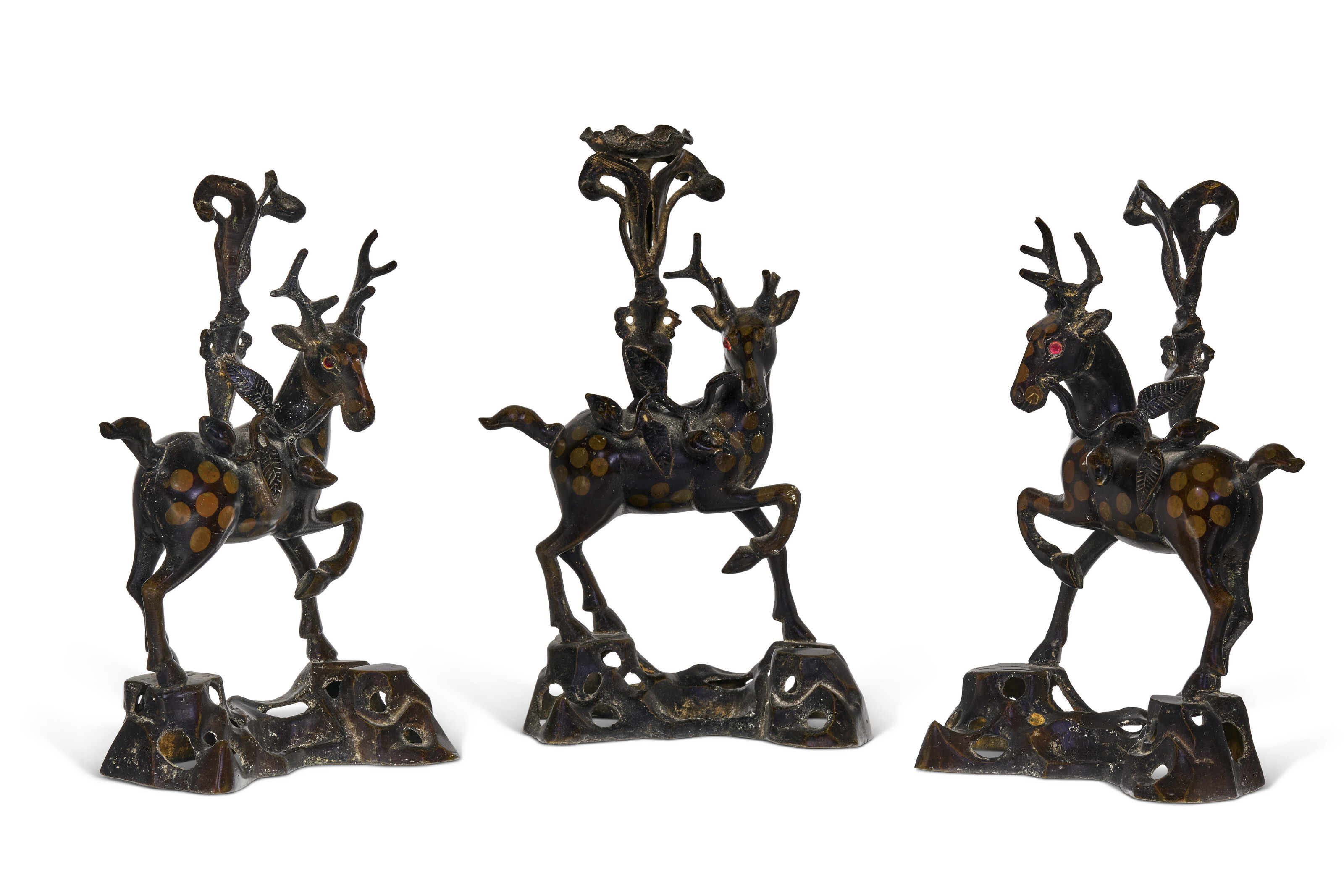A GROUP OF THREE PARCEL-GILT AND PATINATED BRONZE 'CHITAL' DEER, IN THE ...