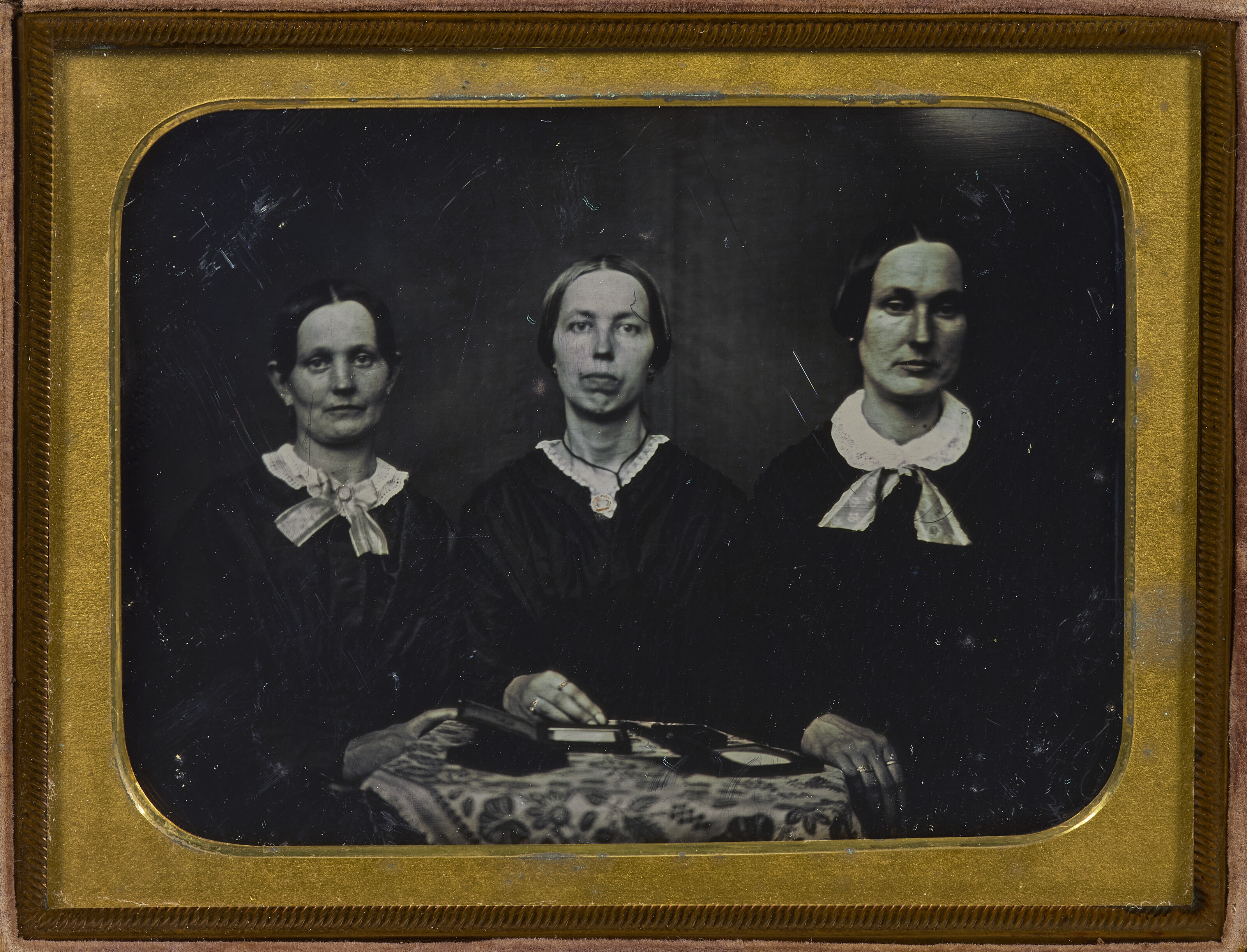 UNKNOWN PHOTOGRAPHER, Portrait of Three Women at a Table with other ...