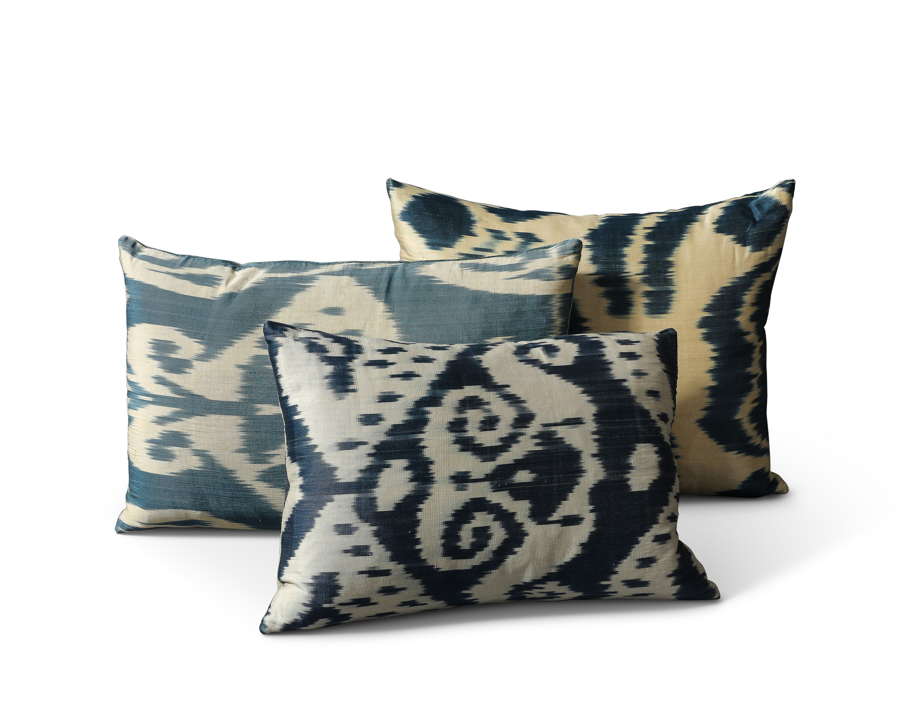 A SET OF THREE IKAT SILK ON COTTON OBLONG CUSHIONS, MODERN, BY MEHMET ...
