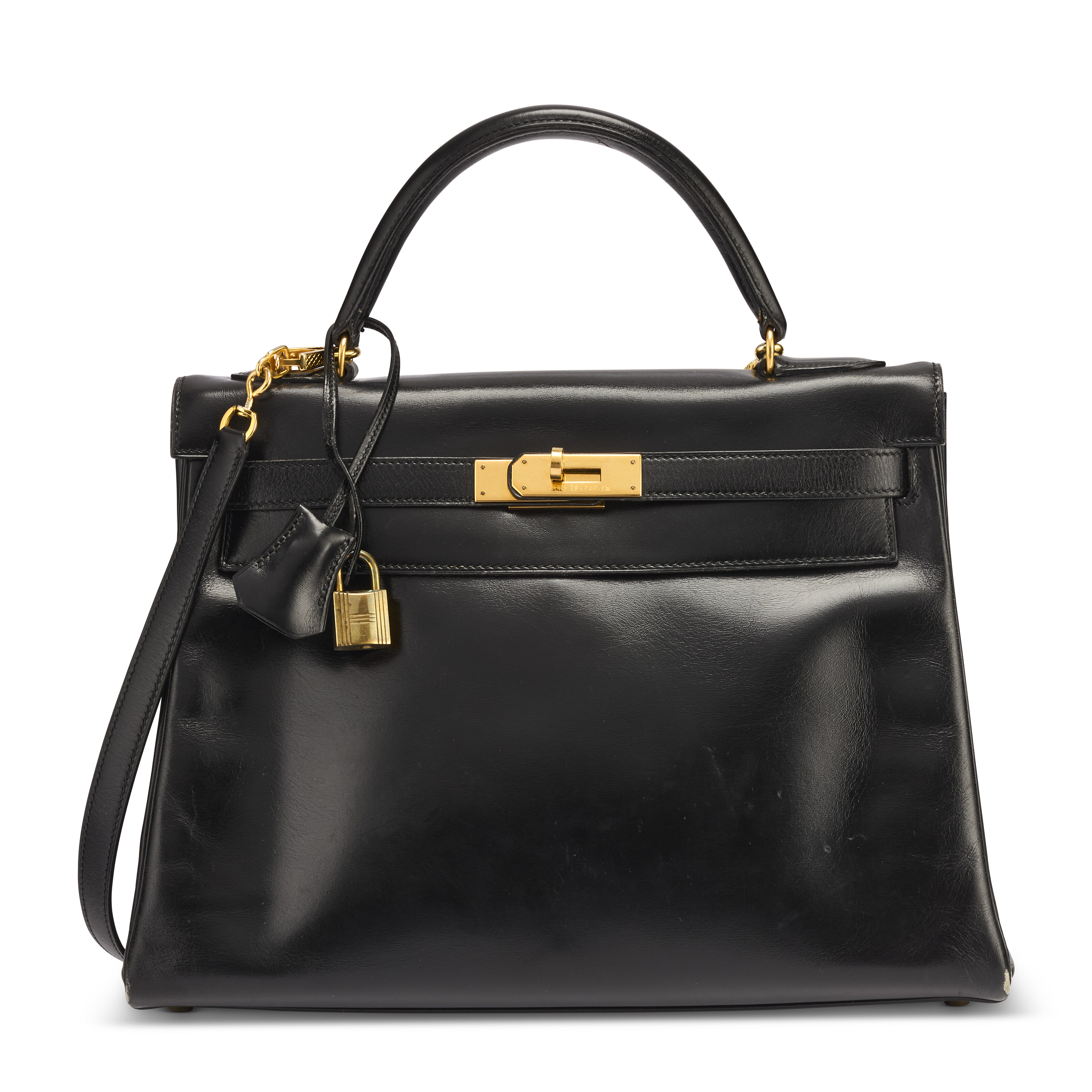 A BLACK CALF BOX LEATHER RETOURNÉ KELLY 32 WITH GOLD HARDWARE, HERMÈS ...